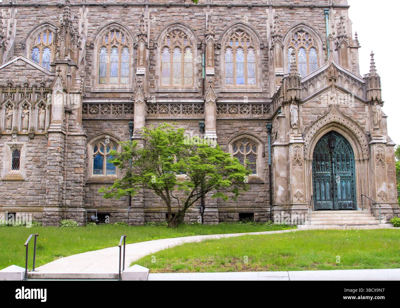 A stone church crafted in Gothic castle style. Its fortified walls ...
