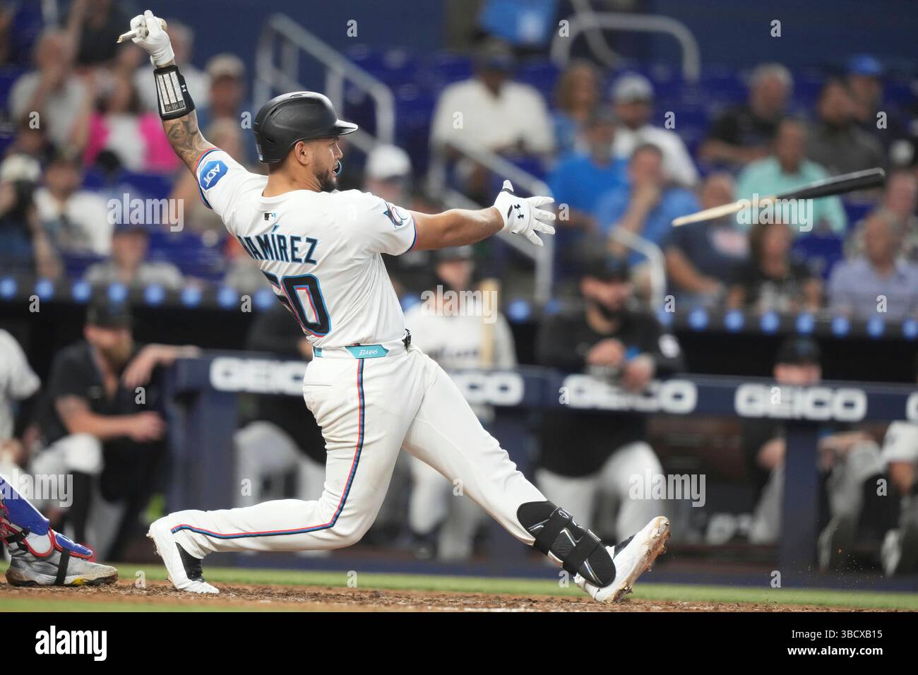 Miami Marlins' Agustin Ramirez breaks his bat as he grounds out to first during the seventh ...