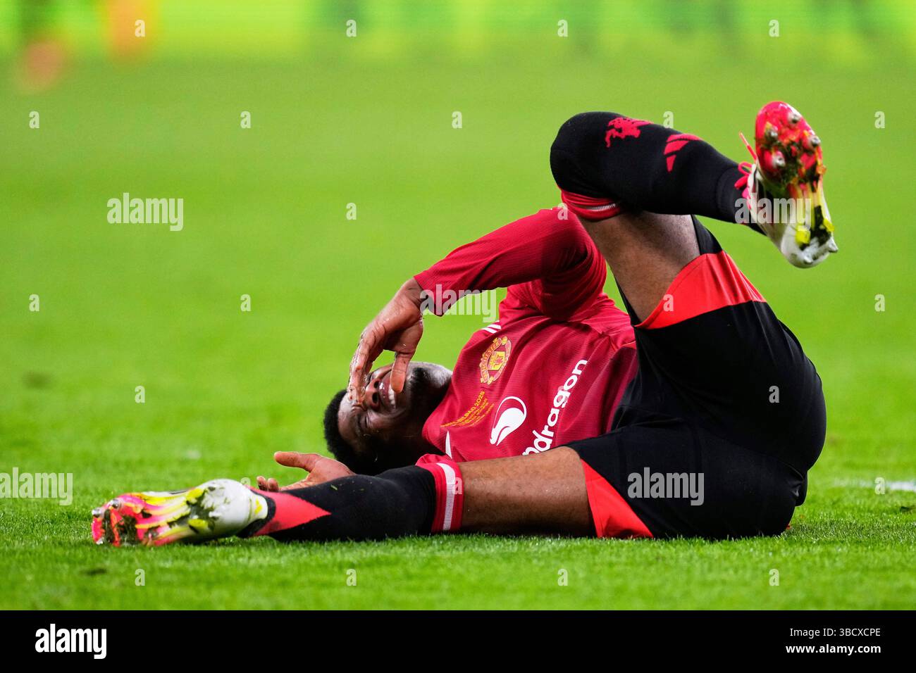 Manchester United's Amad Diallo reacts on the ground during the Europa ...
