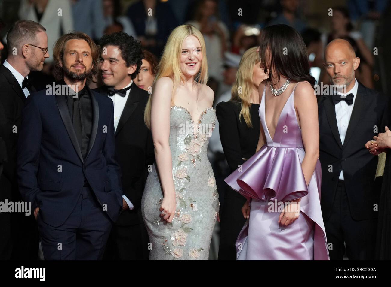 Anders Danielsen Lie, from front left, Elle Fanning, and Renate Reinsve pose for photographers ...