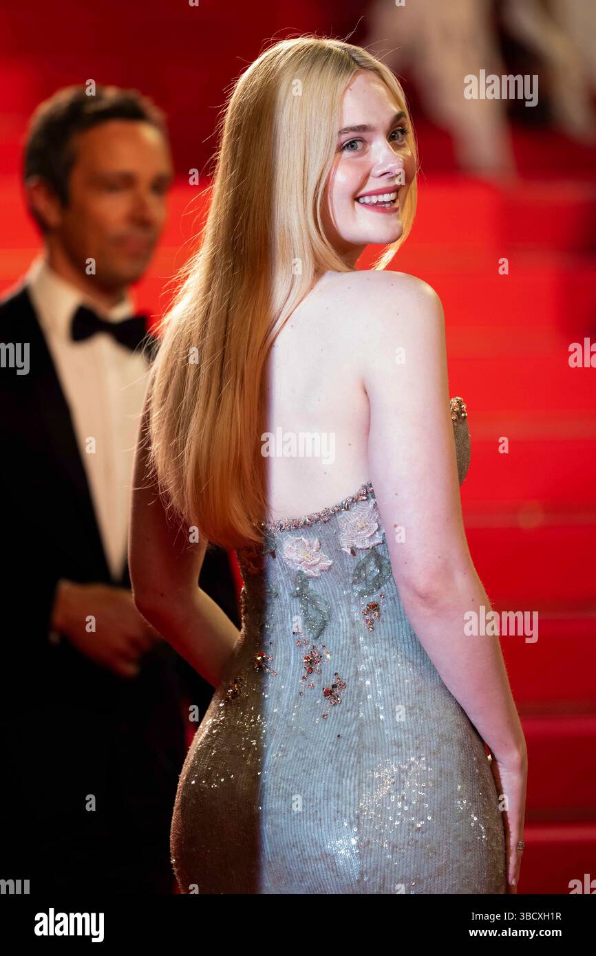 Elle Fanning poses for photographers upon departure from the premiere ...