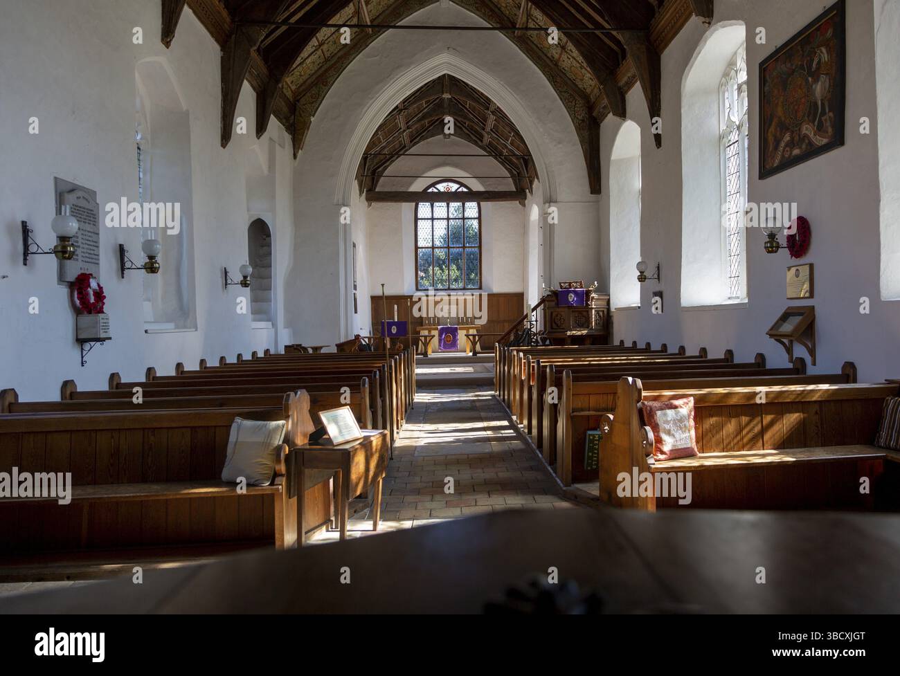 Interior of church view of nave to chancel altar and east window ...