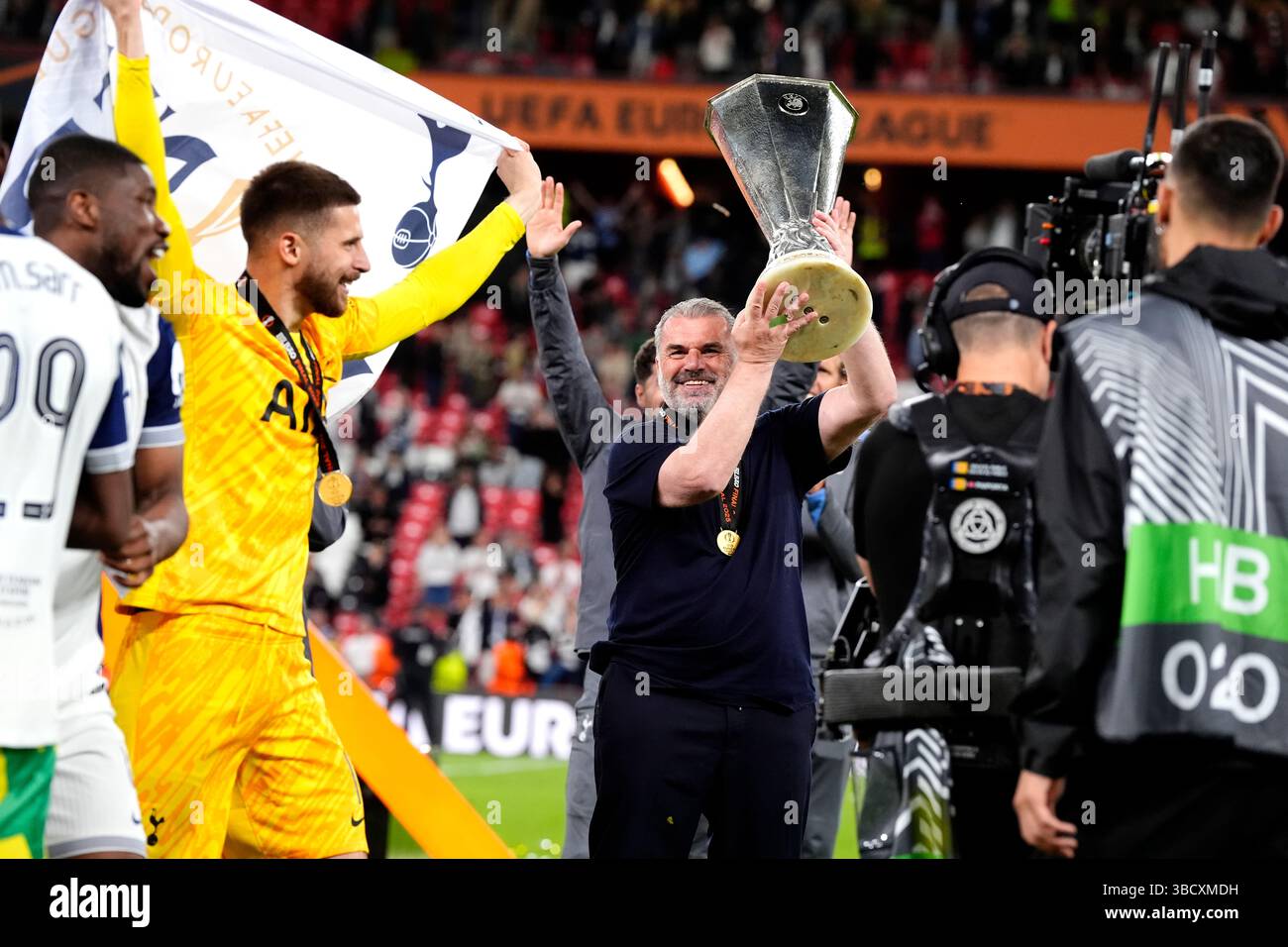 Tottenham Hotspur manager Ange Postecoglou celebrates with the trophy ...