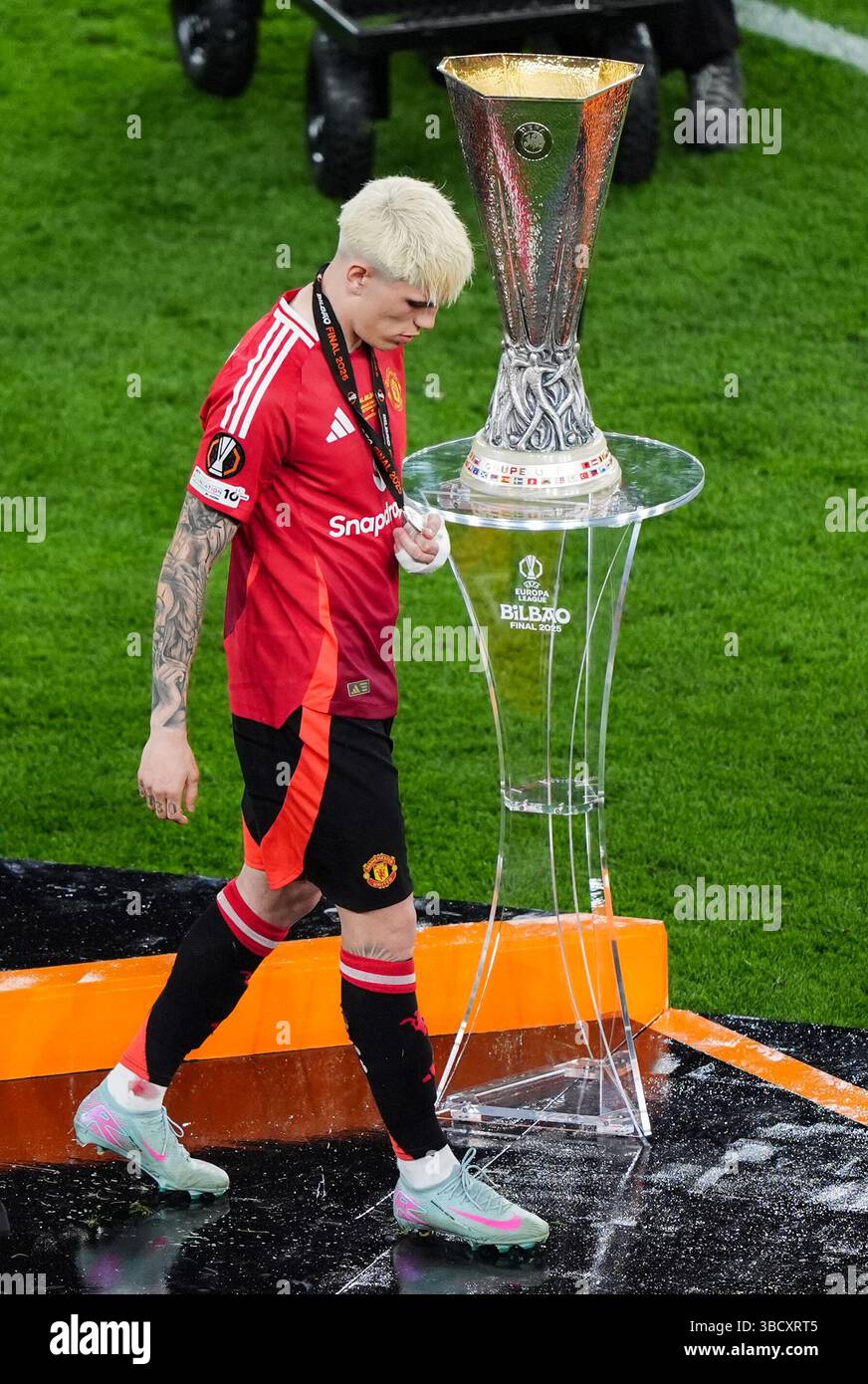 Manchester United's Alejandro Garnacho looks dejected as he walks past ...