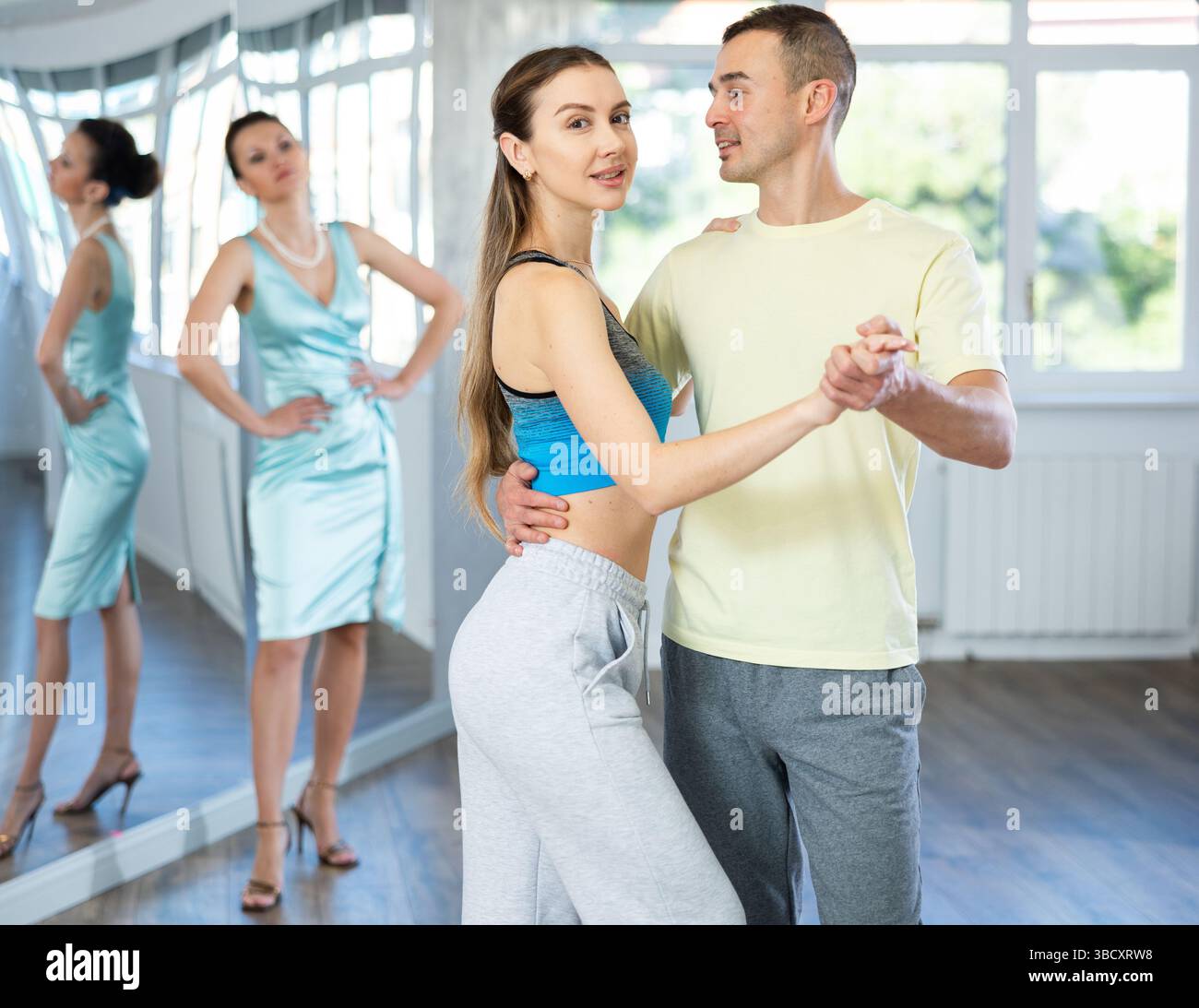 Positive couple practicing slow foxtrot in dance studio Stock Photo - Alamy