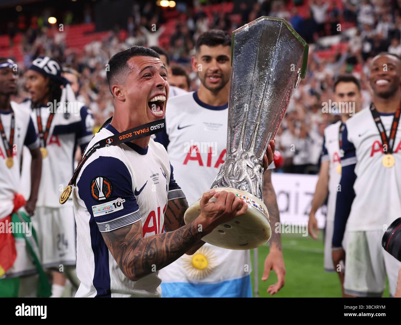 Bilbao, Spain. 21st May, 2025. Pedro Porro of Tottenham with the trophy ...
