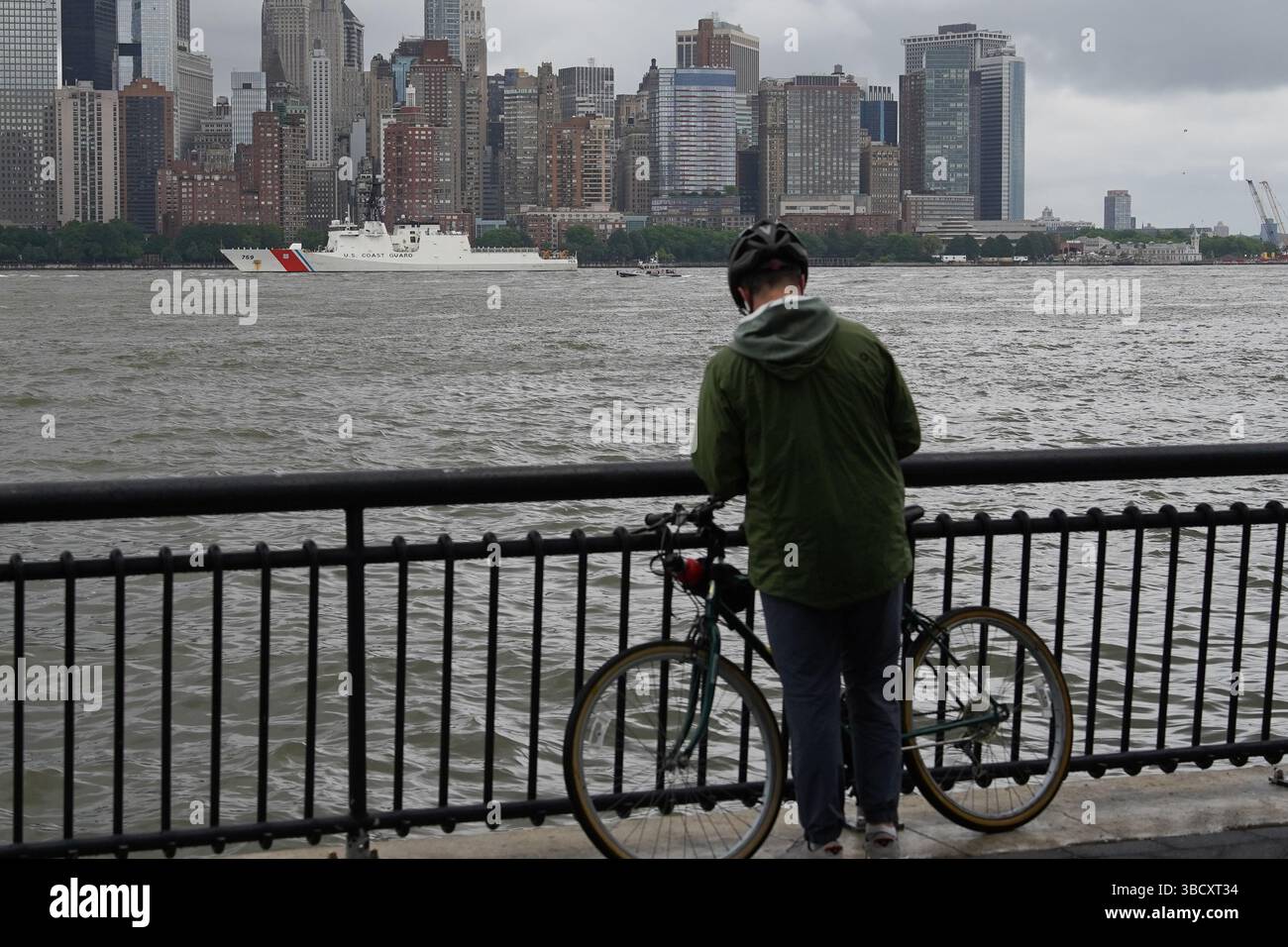 Manhattan, United States. 21st May, 2025. A cyclist takes a photo of ...