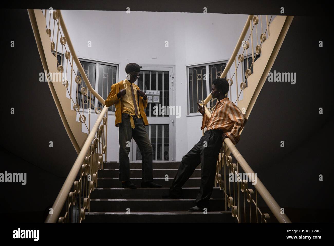 Dakar, Senegal. 15th May, 2025. Costumed people pose on the stairs of ...