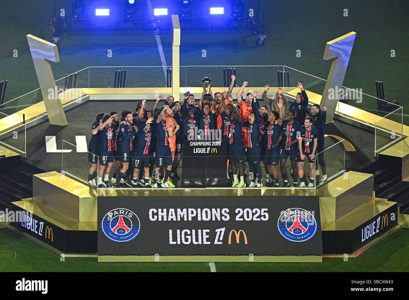 Paris, France. 17th May, 2025. PSG players celebrate and lift the Ligue 1 McDonald's Champion ...