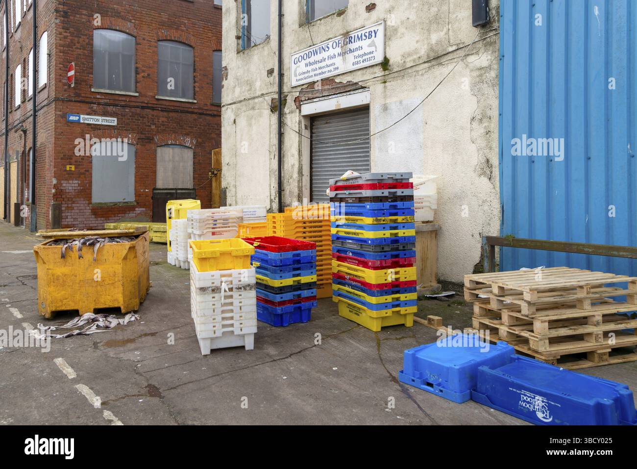 Fish trays and fish carcasses in waste skip. Grimsby docks, north east ...
