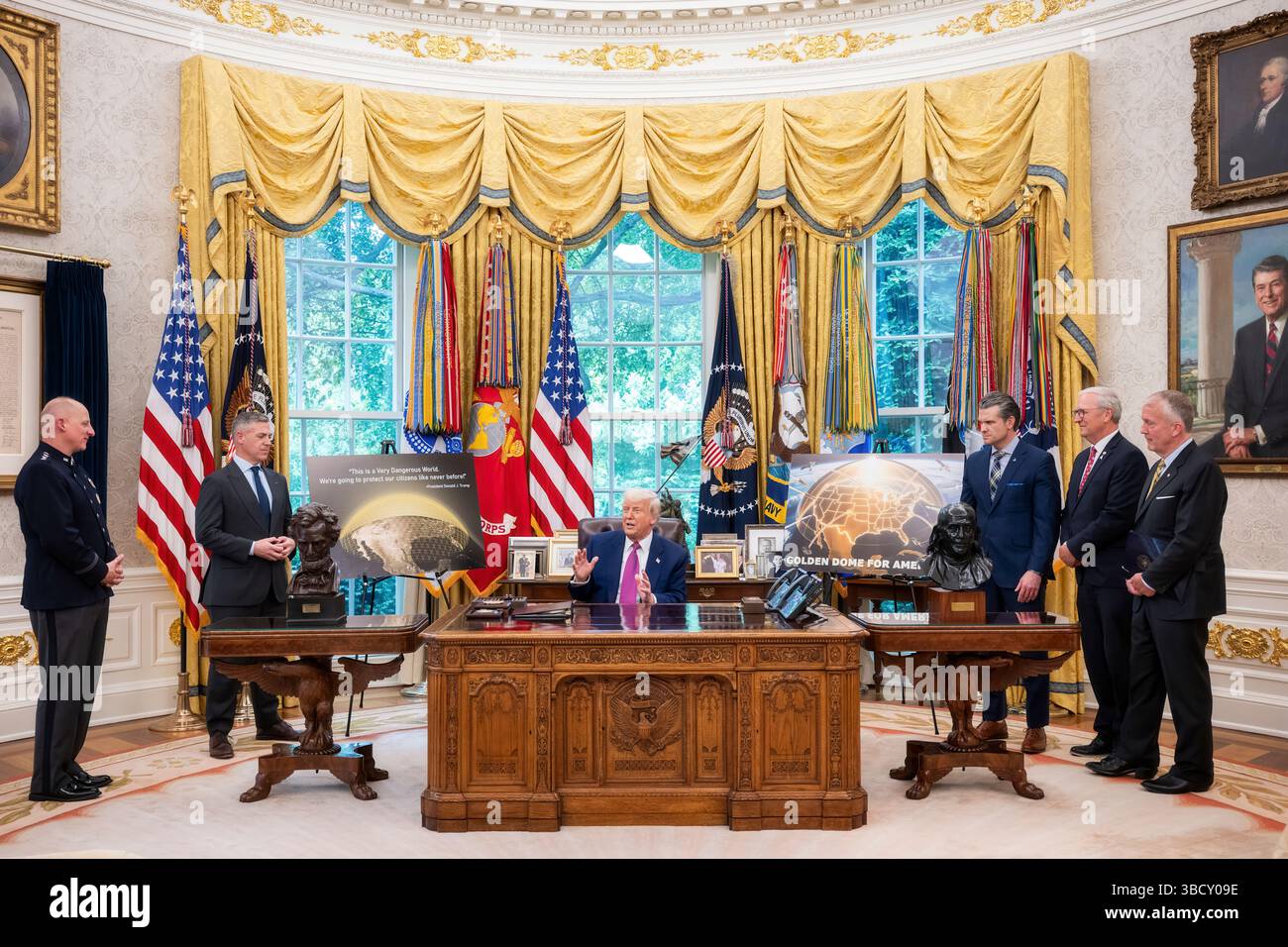 President Donald Trump speaks with Secretary of Defense Pete Hegseth ...