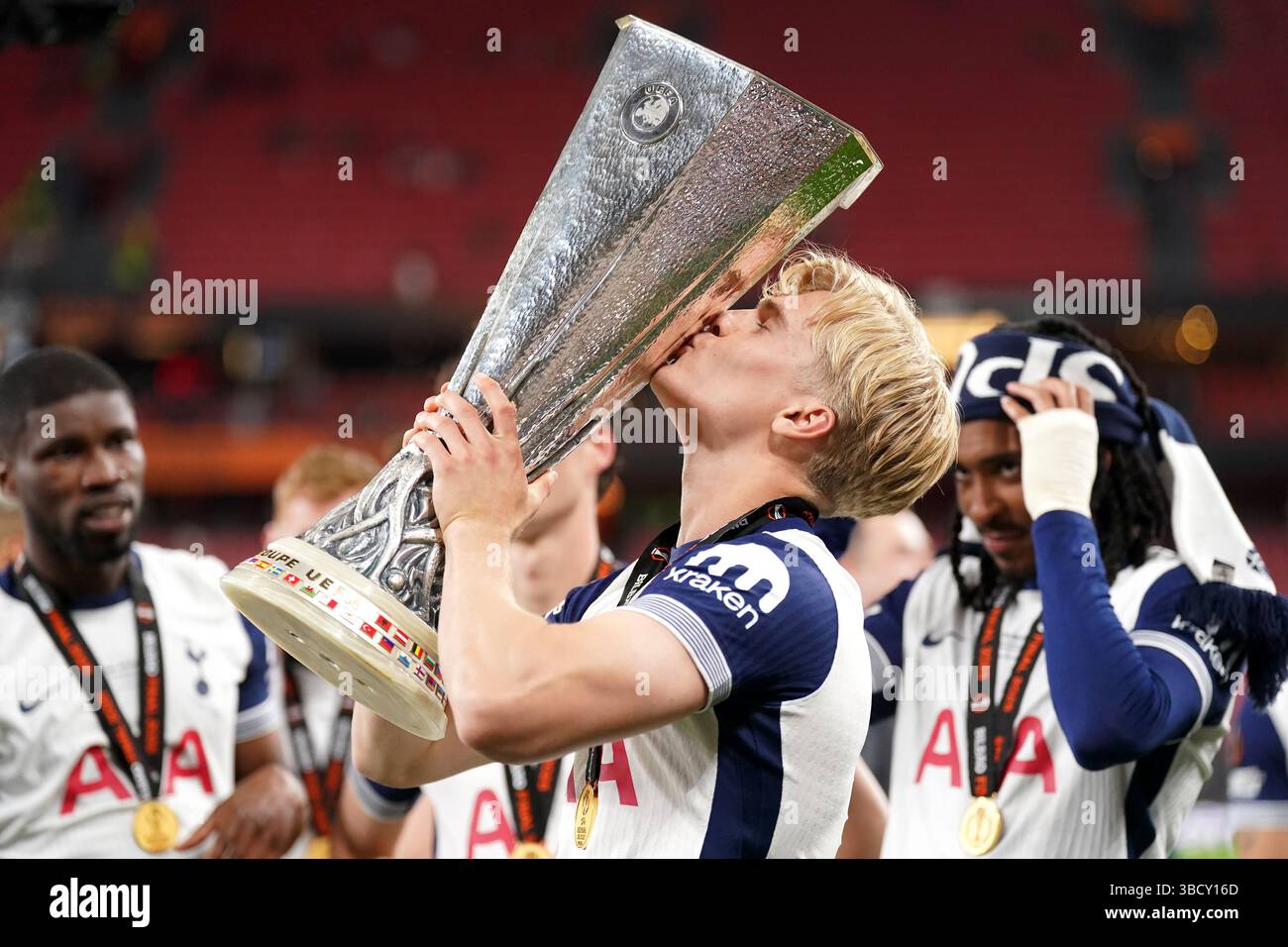 Tottenham Hotspur's Lucas Bergvall kisses the UEFA Europa League trophy ...