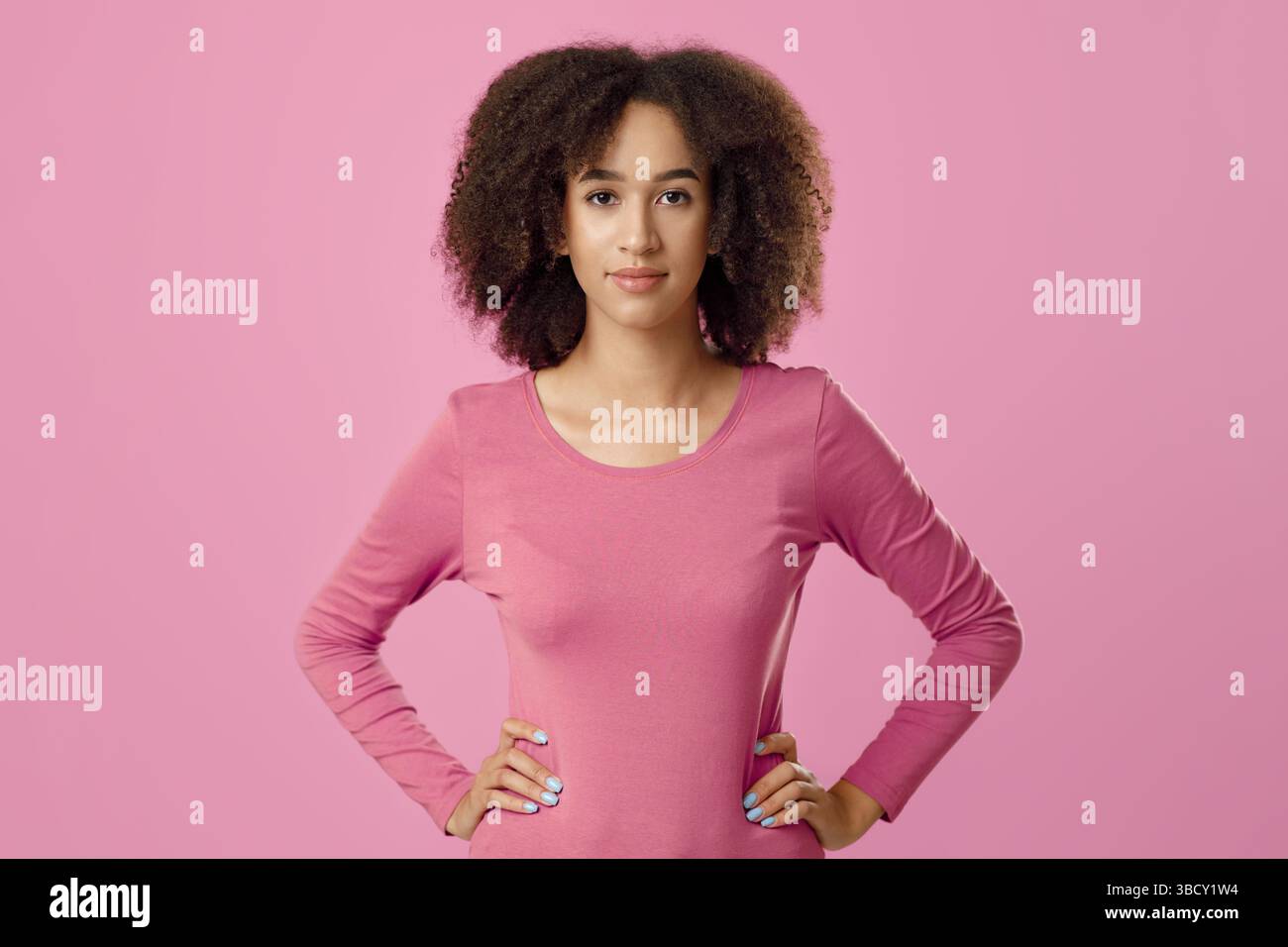 Serious facial expression, beautiful curly haired model Stock Photo - Alamy