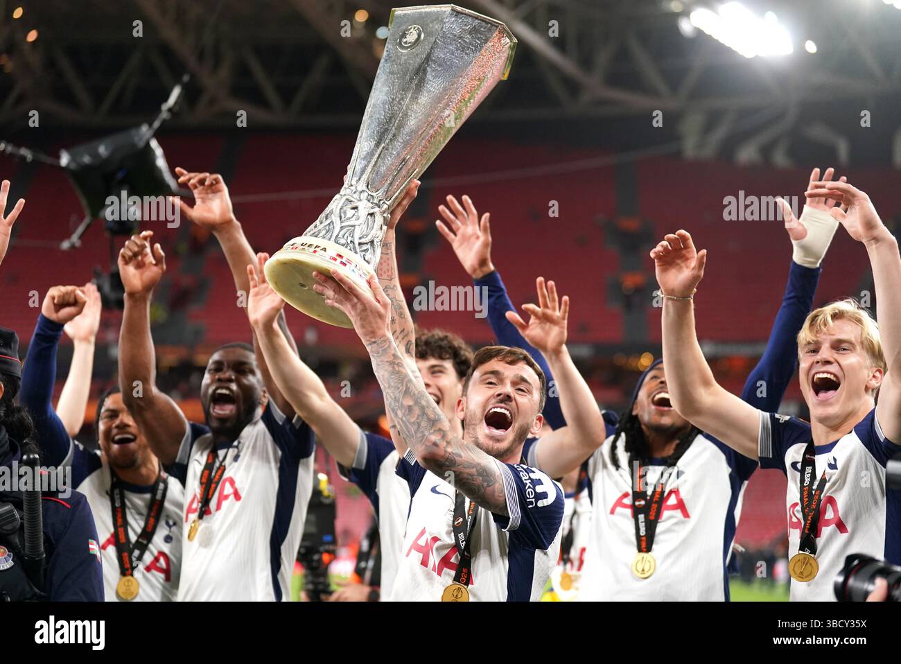 Tottenham Hotspur's James Maddison (centre) celebrates with the trophy ...