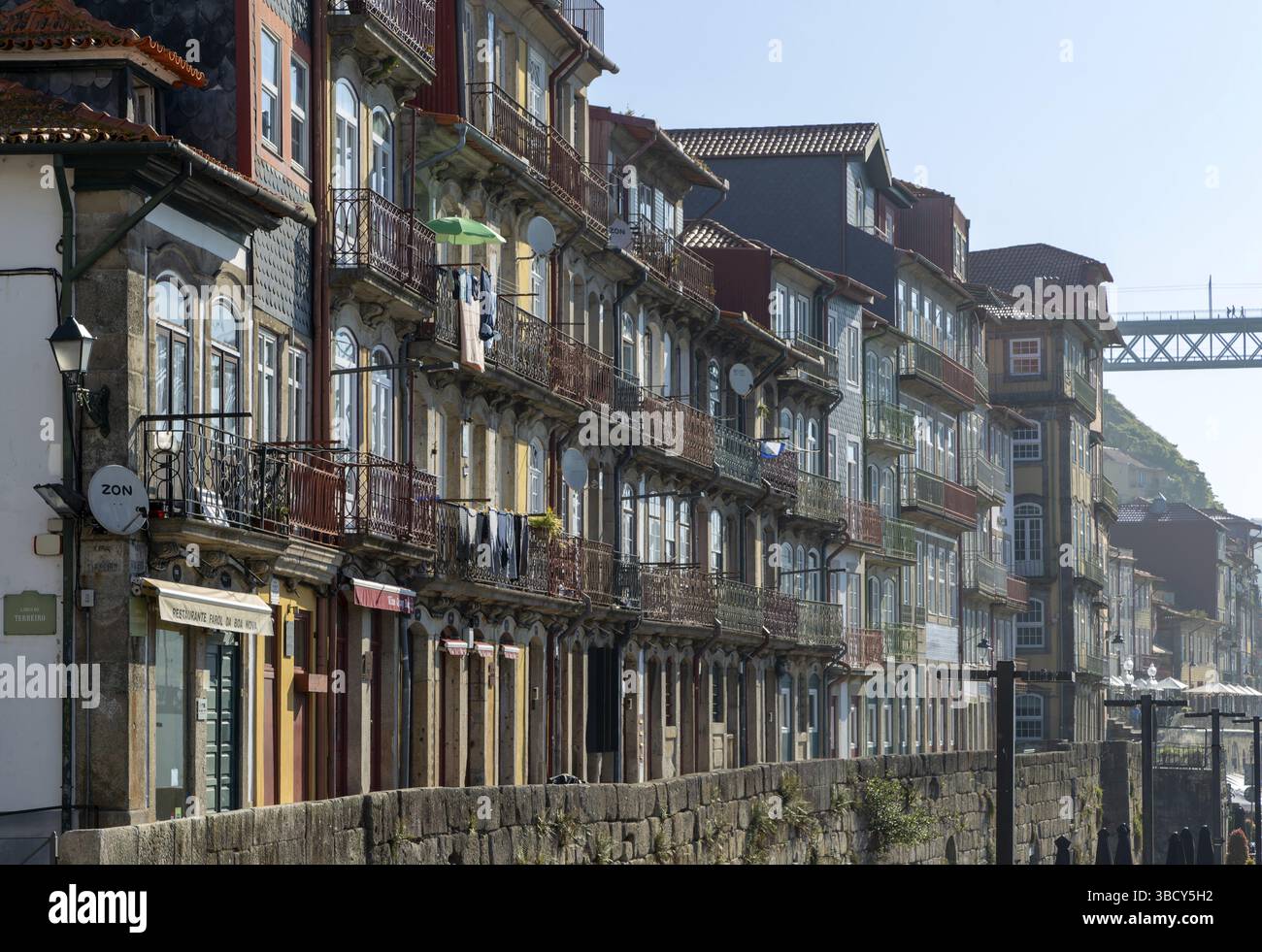 Historic buildings with balconies on waterfront of Ribeira district ...