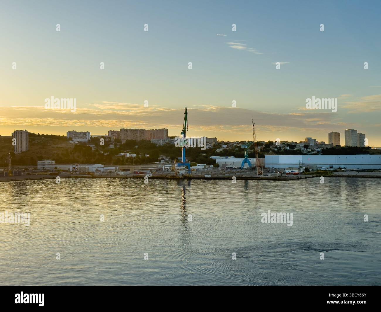 Marseille, France - July 10, 2024: Sunrise over container terminal and ...