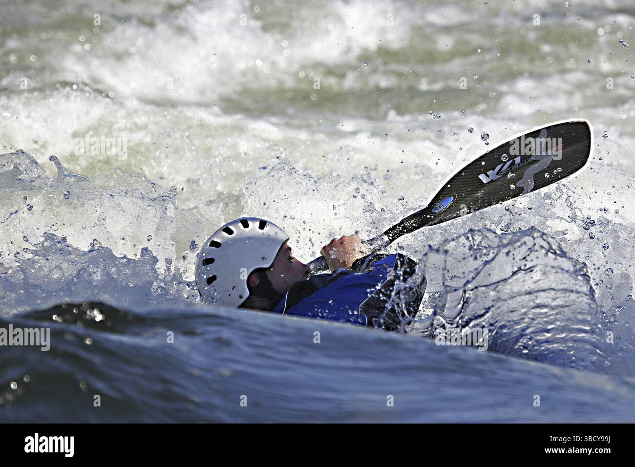 Kayaker kayaking in kayak in white water rapid Stock Photo - Alamy
