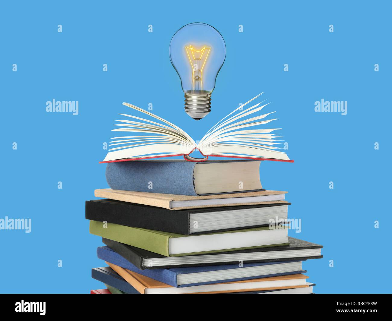 Light bulb in air over stack of books on light blue background. Idea ...
