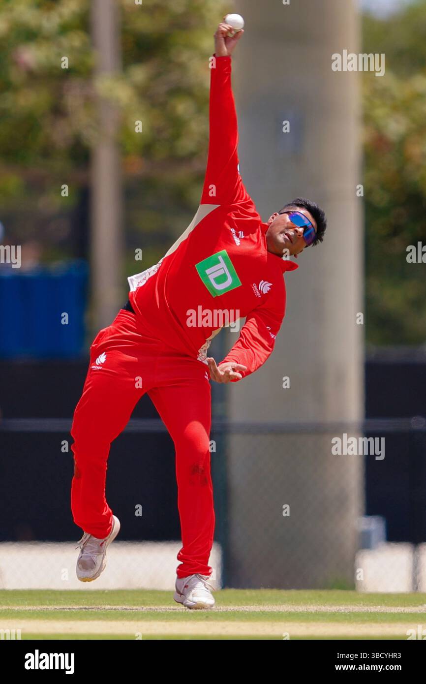 FT LAUDERDALE, FL - MAY 17: Canada player Harsh Thaker (18) bowling a ...