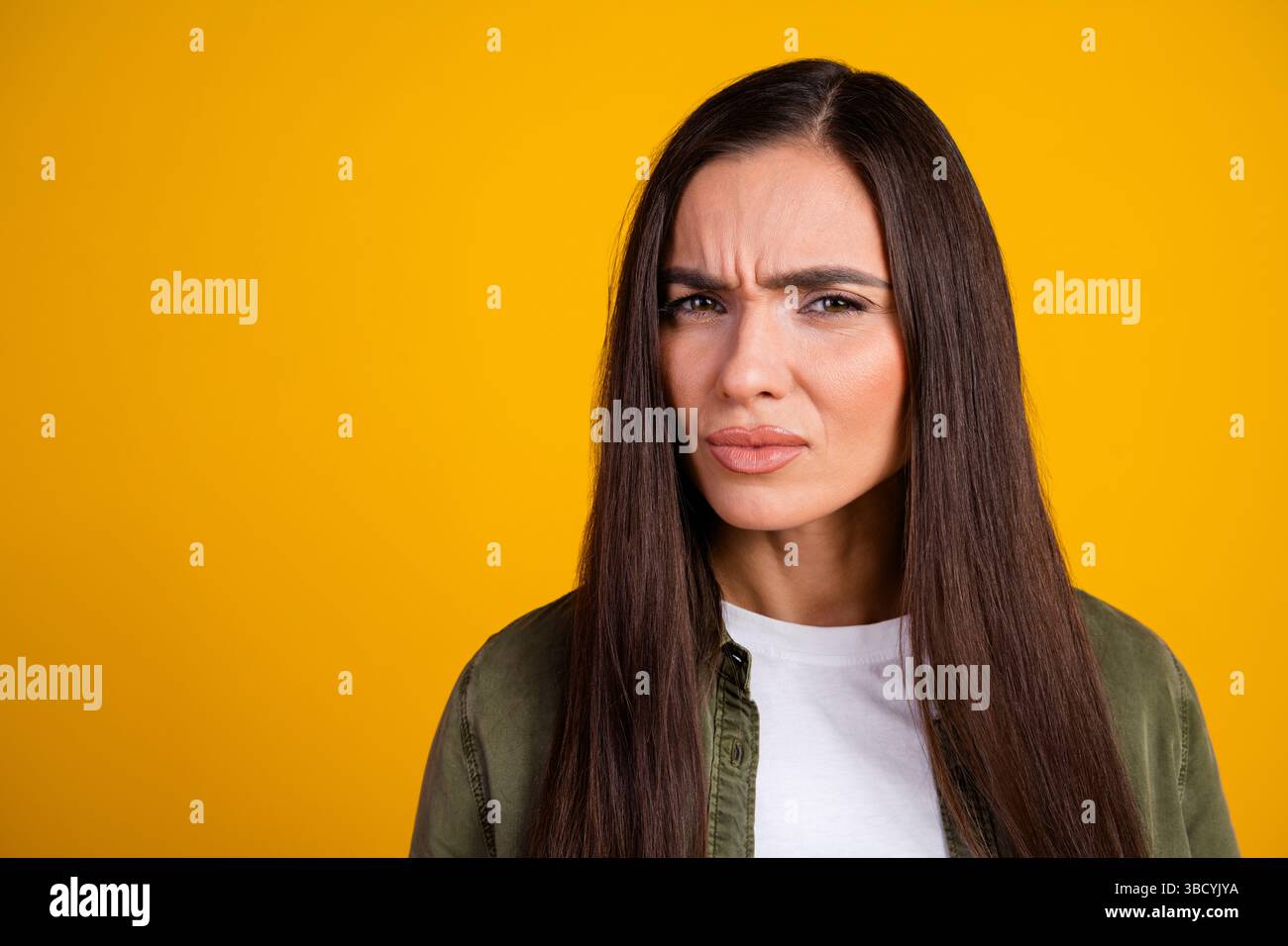 Confused Young Woman Wearing Casual Outfit Poses Against Yellow ...