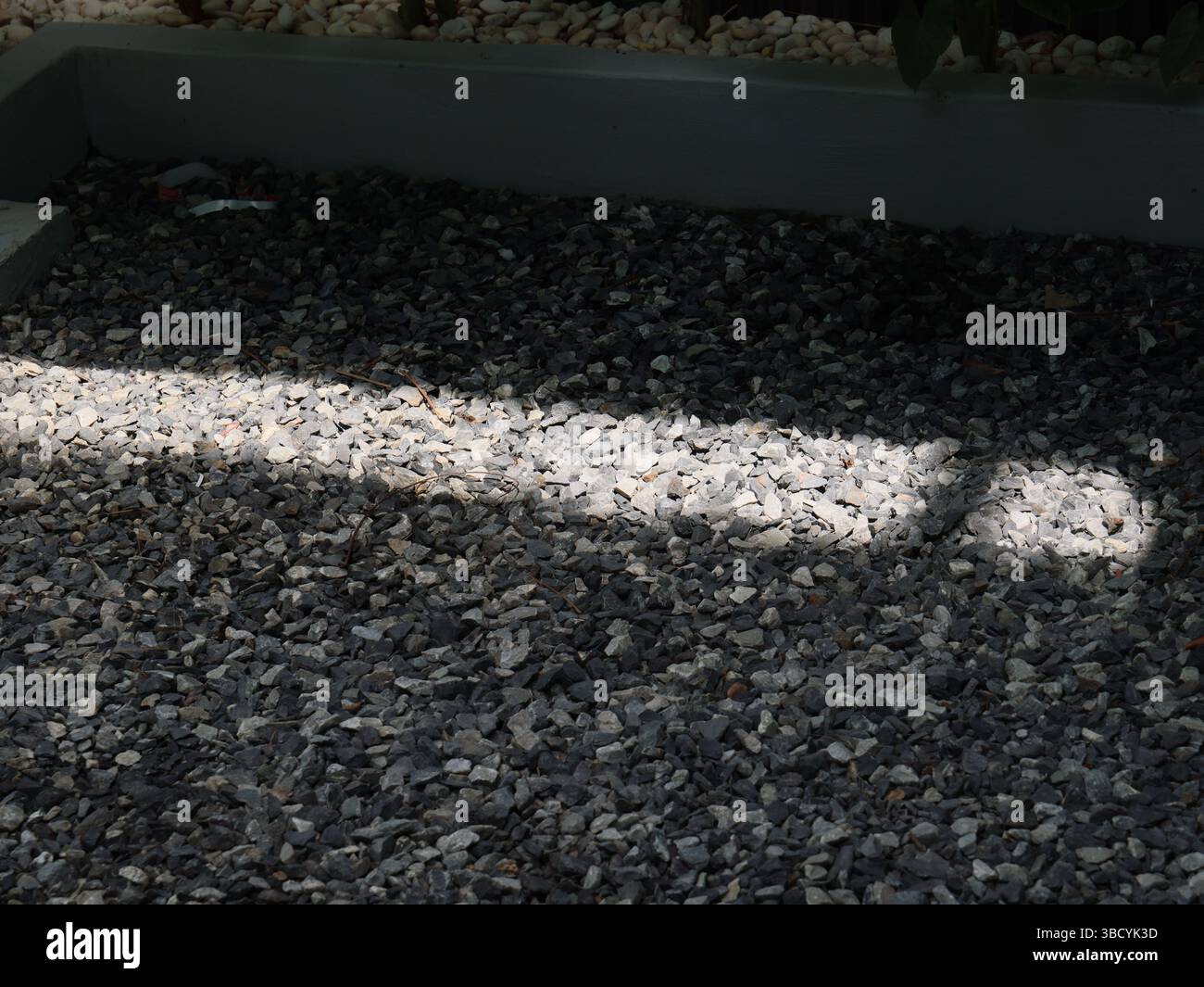 Shadows Cast on a Gravel Surface Under Natural Light During the Daytime ...