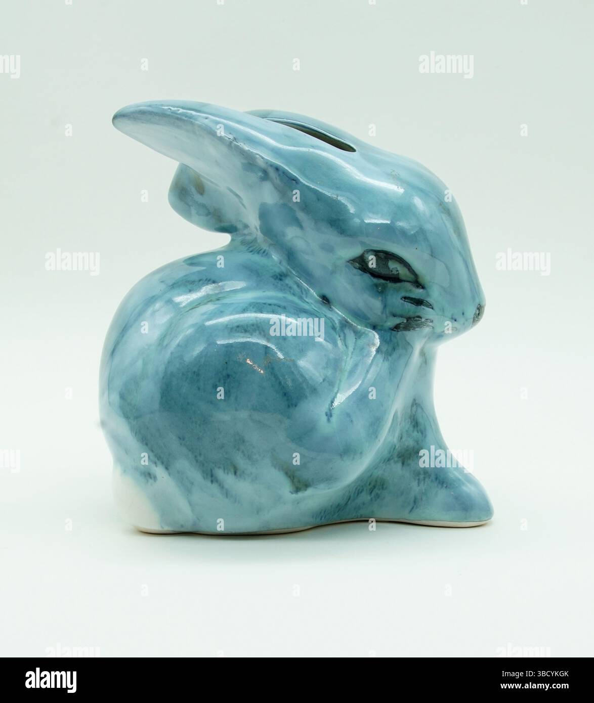 Blue ceramic rabbit money box made by David Sharp Pottery, Rye Stock ...