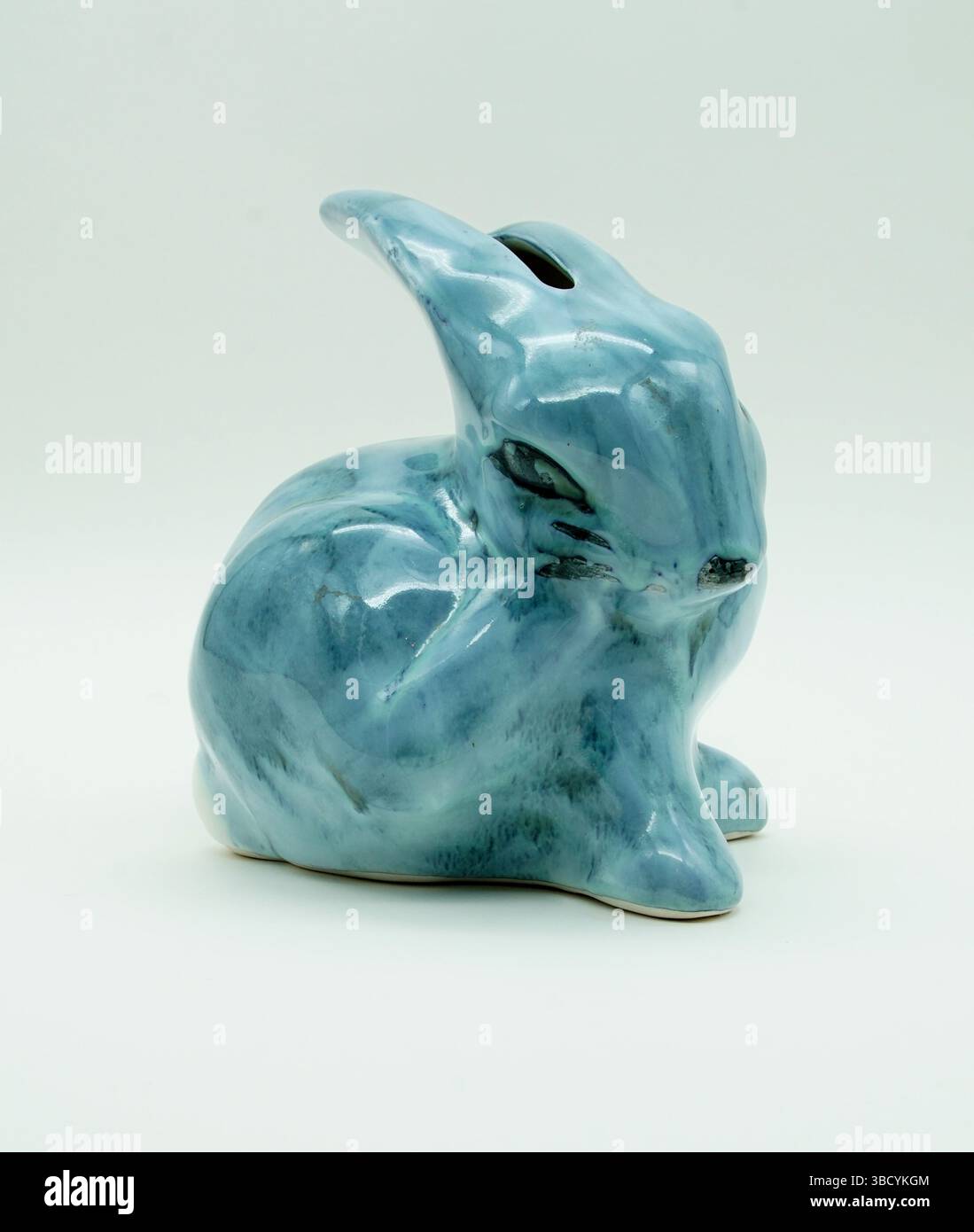 Blue ceramic rabbit money box made by David Sharp Pottery, Rye Stock ...