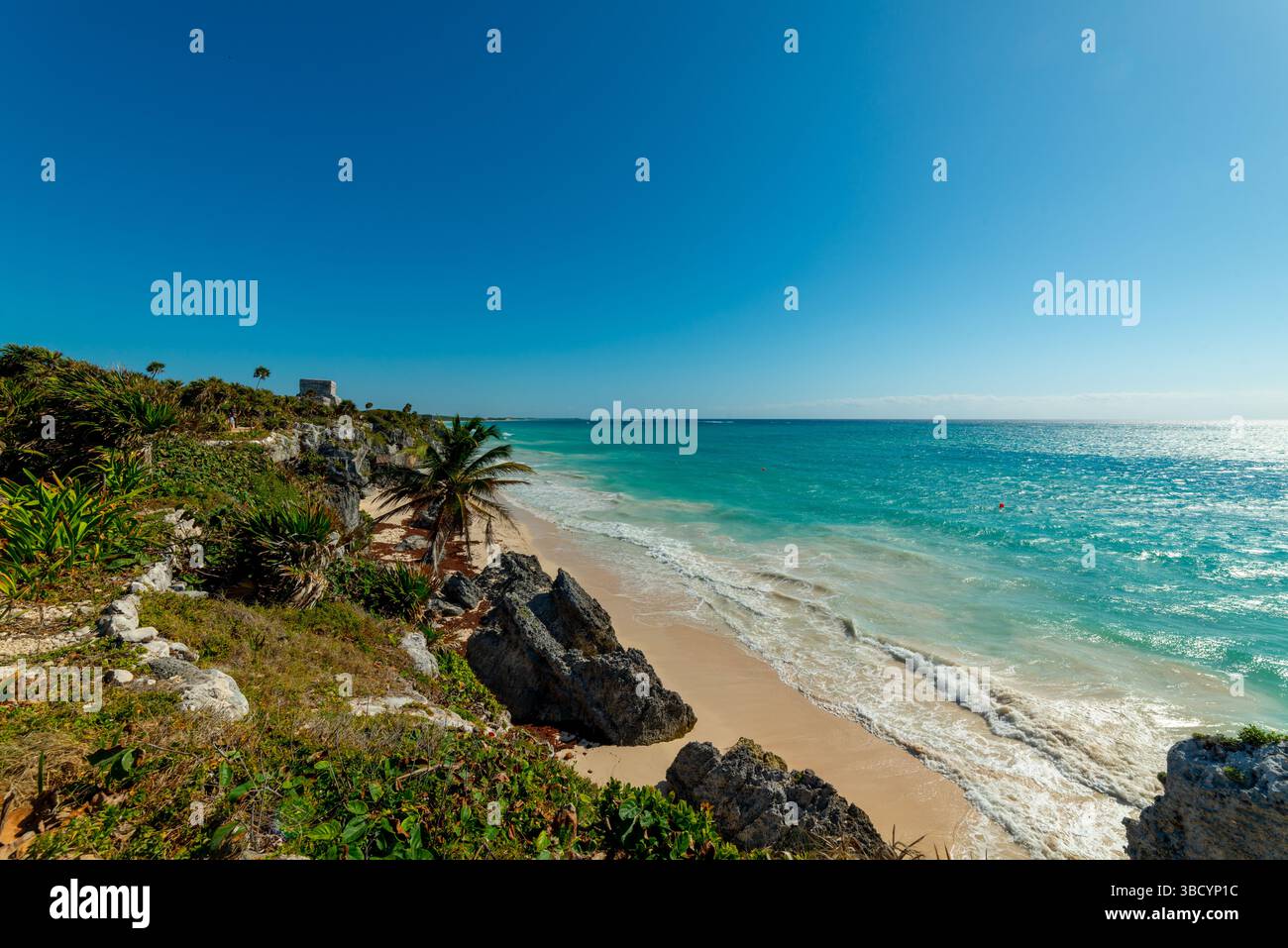 The Mayan Ruins of Tulum during a summer blue sky with some sargassum ...