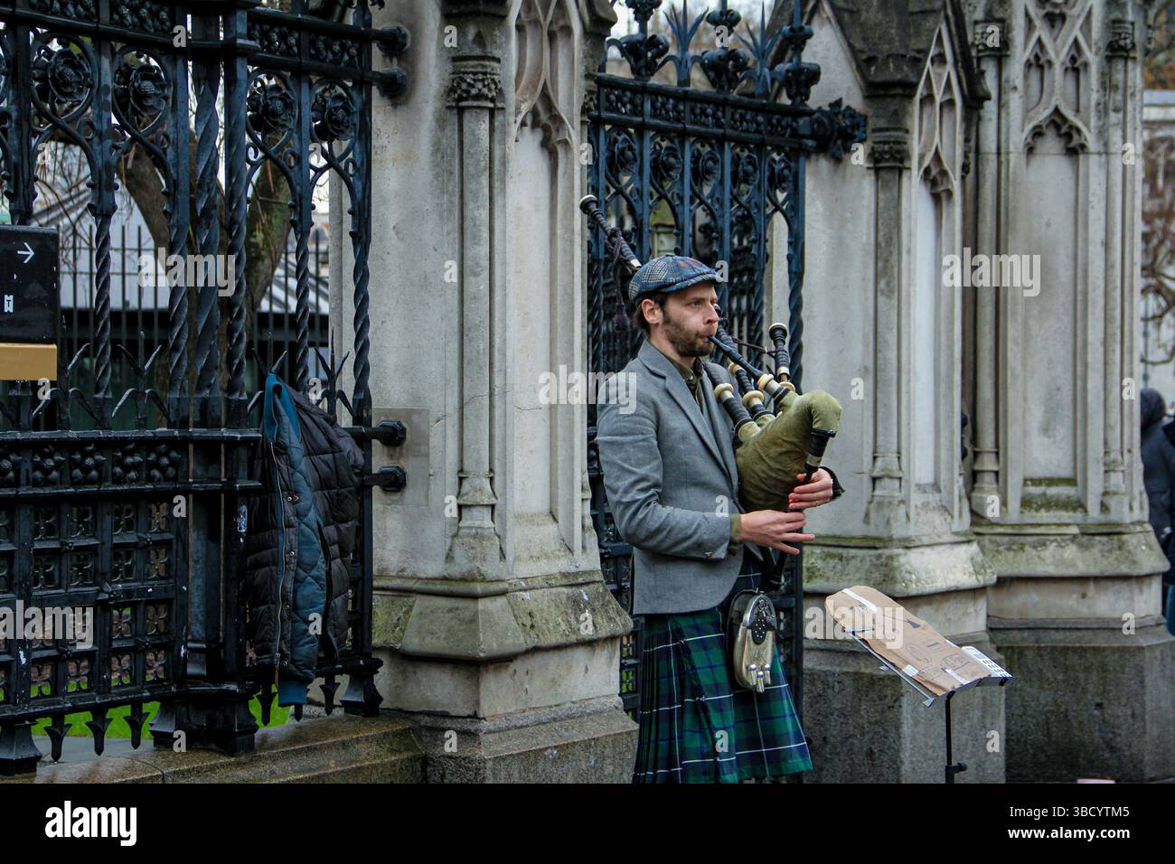 Middle-aged bearded man playing the bagpipes, a traditional Scottish ...