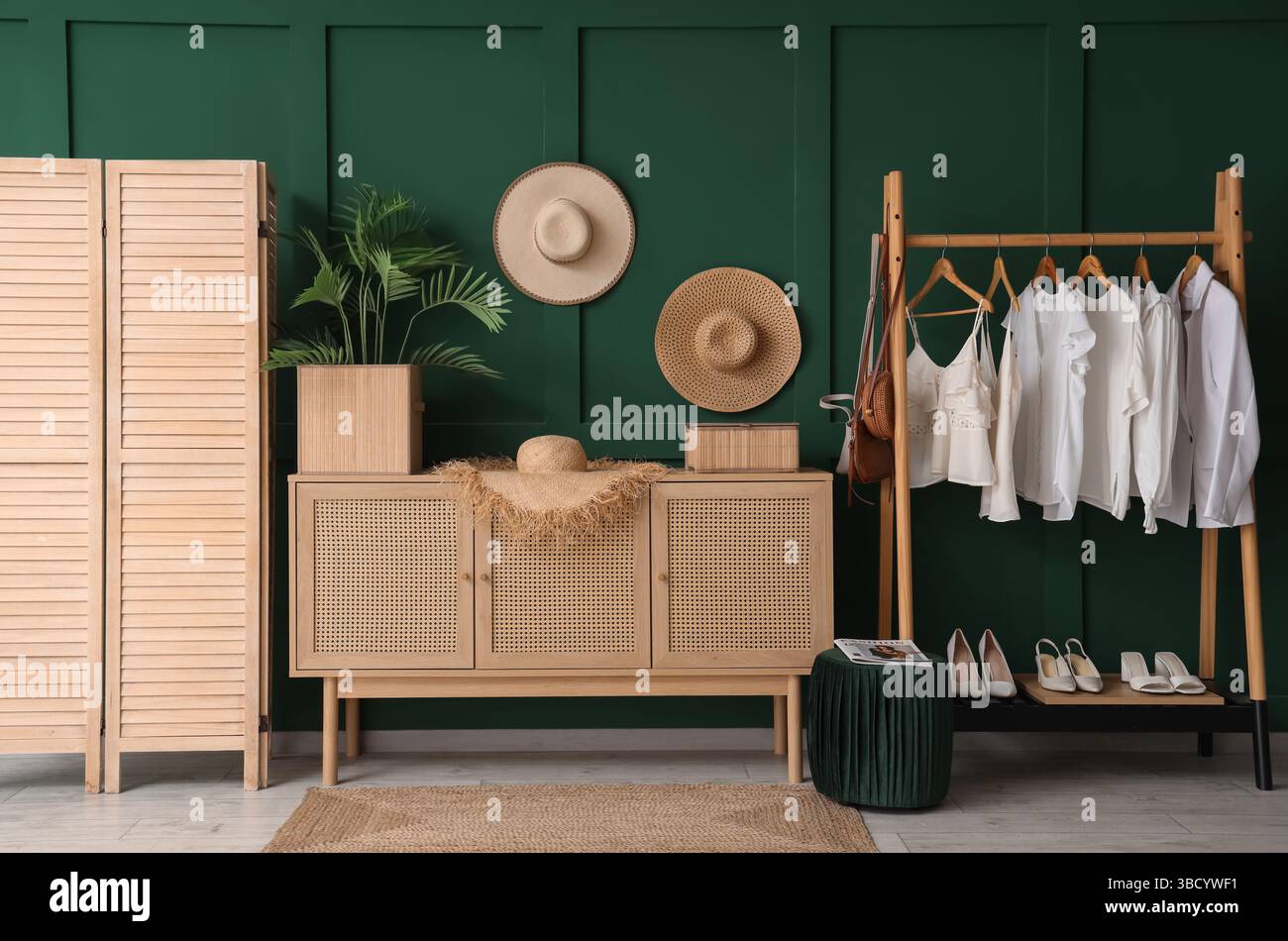 Interior of hall with commode, hats and clothes rack Stock Photo - Alamy