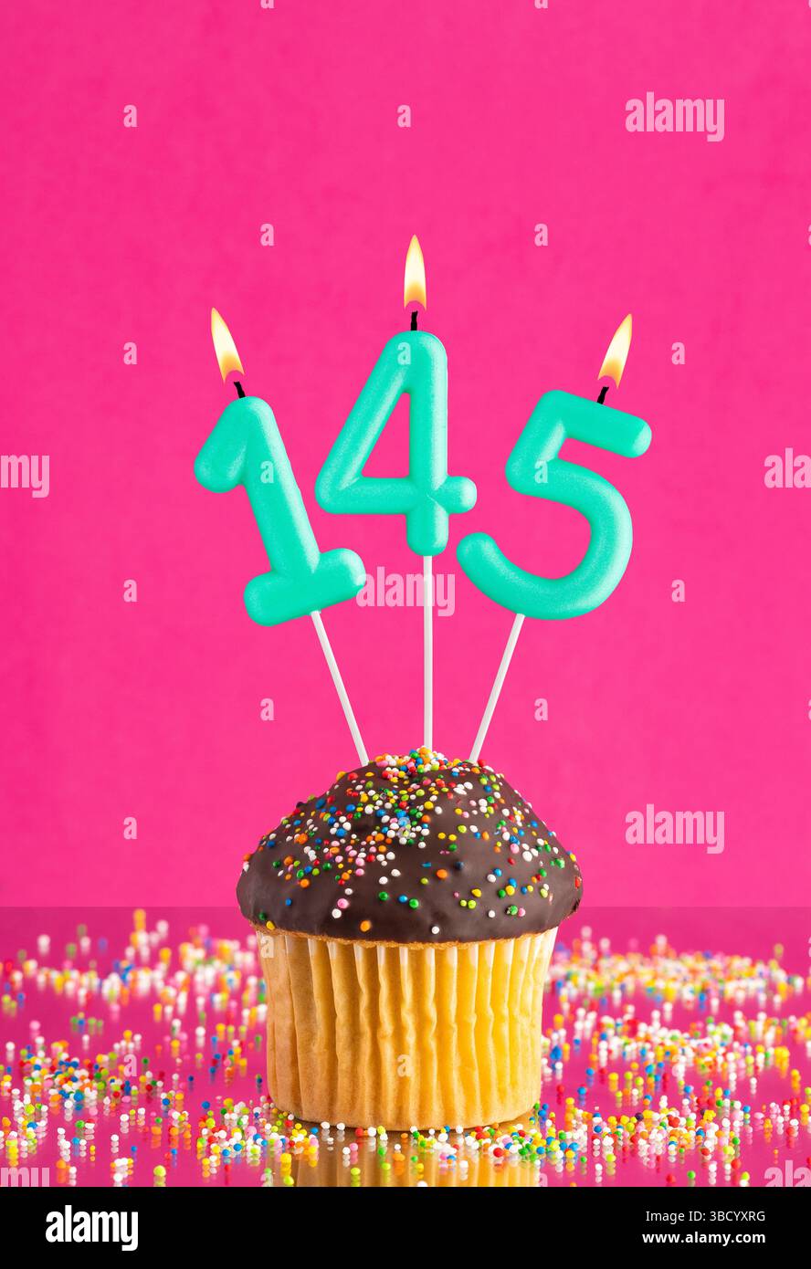 Birthday cupcake with number 145 candle - Celebration card on fuchsia ...