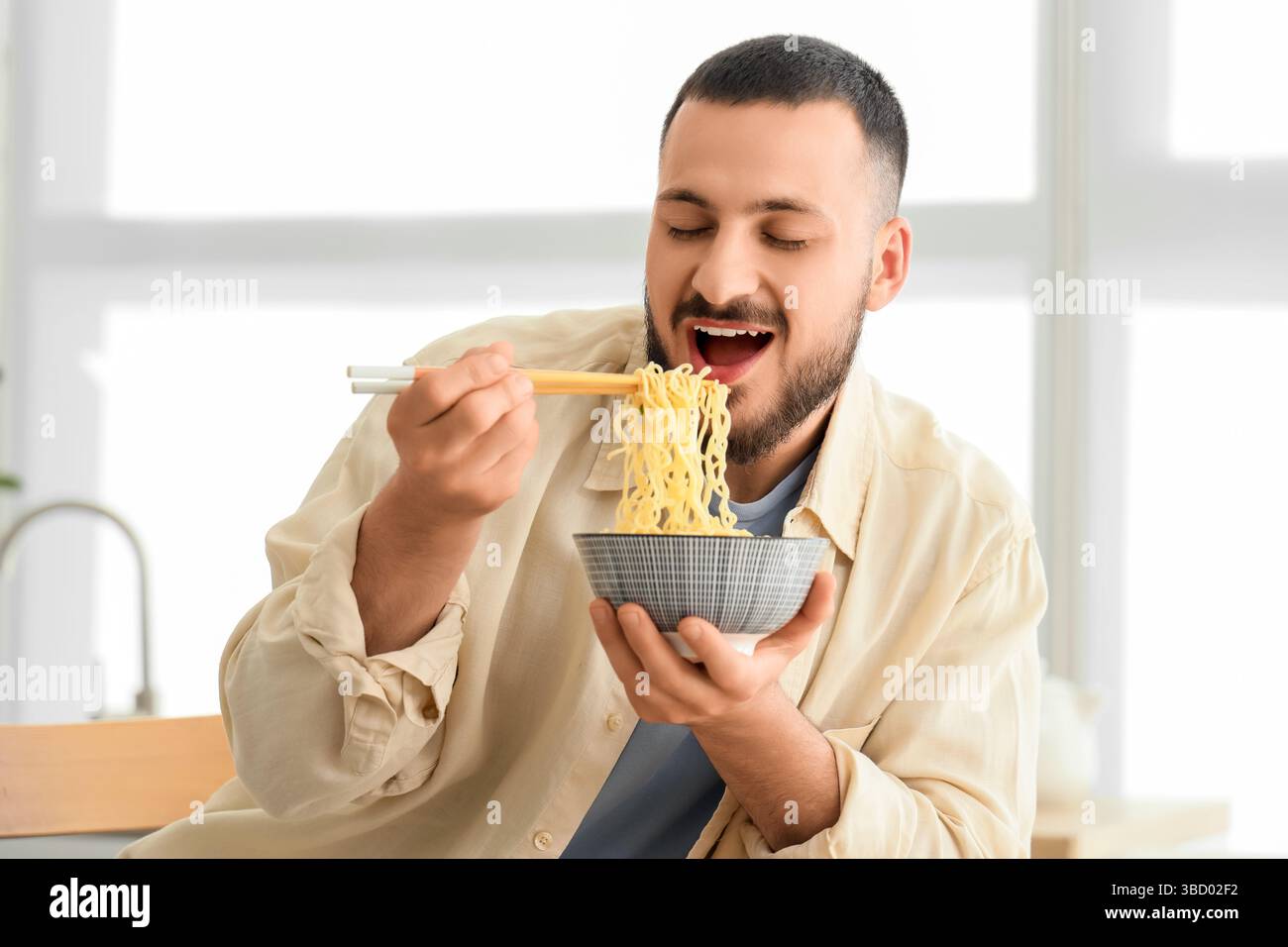 Man eating boiled egg hi-res stock photography and images - Alamy
