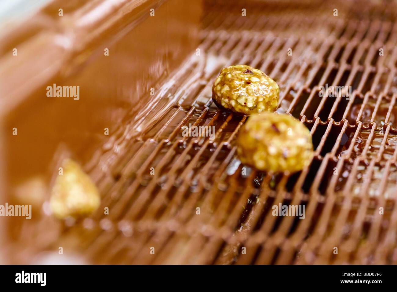 Candy enrobing process in action, showcasing curtain coating technique ...