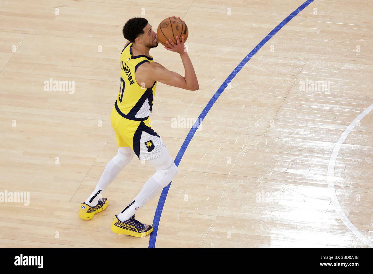 Indiana Pacers guard Tyrese Haliburton (0) steps on the 3-point line as ...
