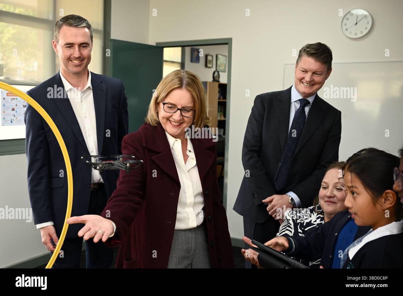 Melbourne, Australia. 22nd May, 2025. Students land a drone on the hand ...