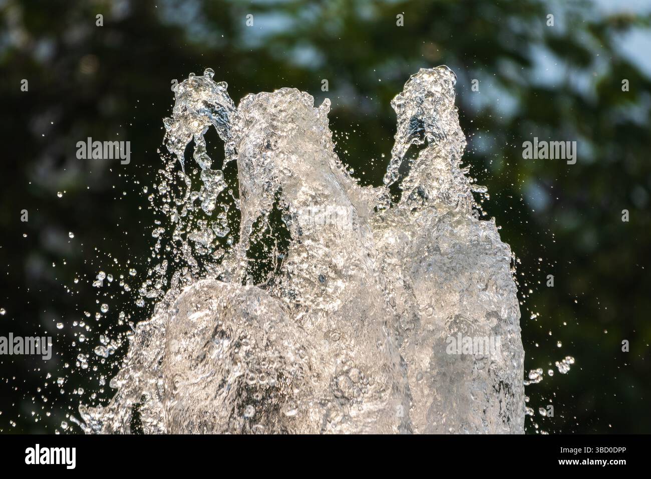 Water splashes from fountain on dark background. Natural texture of ...