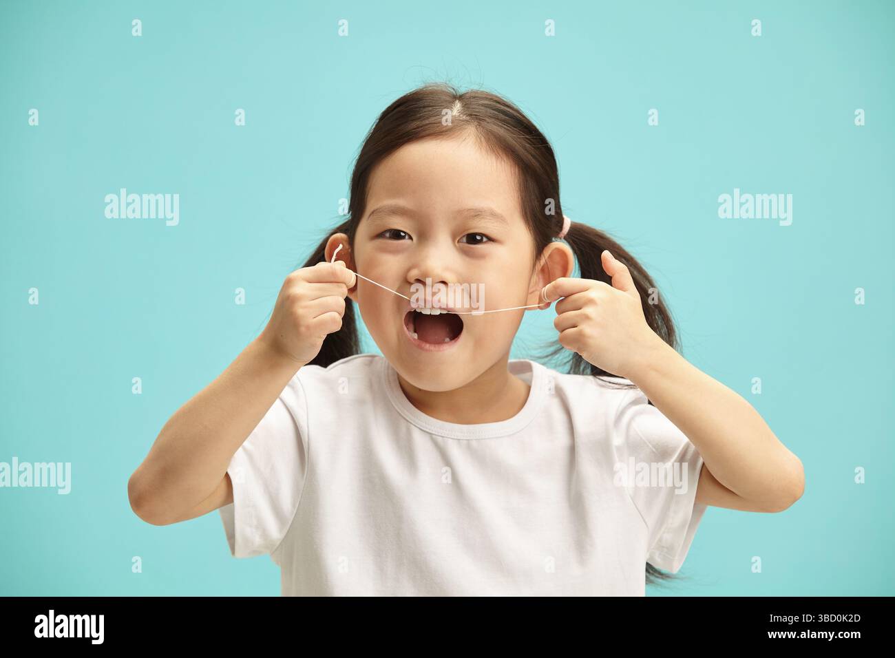 Female japanese child with mouthly wide open clean myself her teeth ...