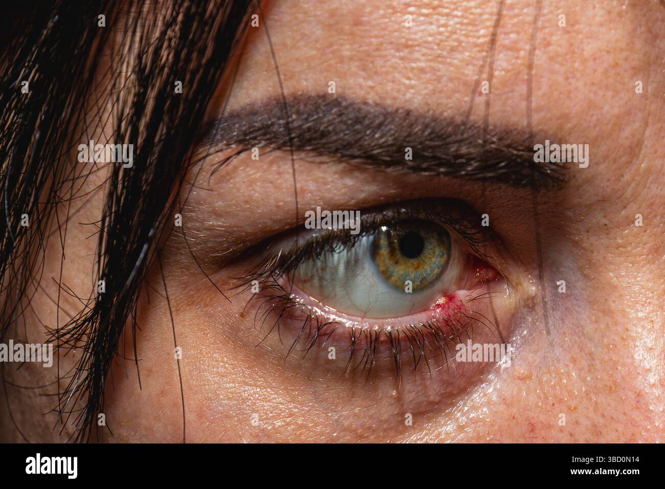 A vivid close-up displays a human eye, highlighting the unique colors and textures. The iris ...