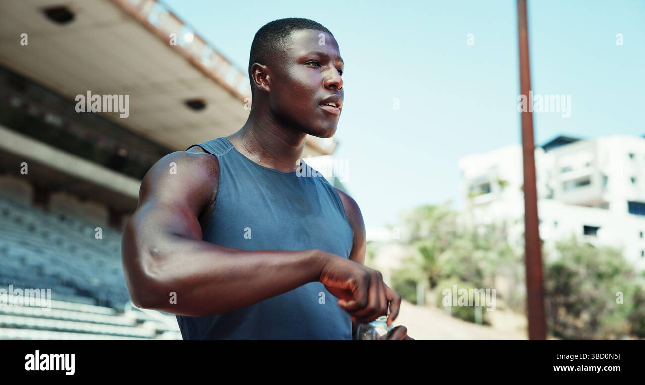 Thinking, black man and water bottle at stadium for fitness, planning ...