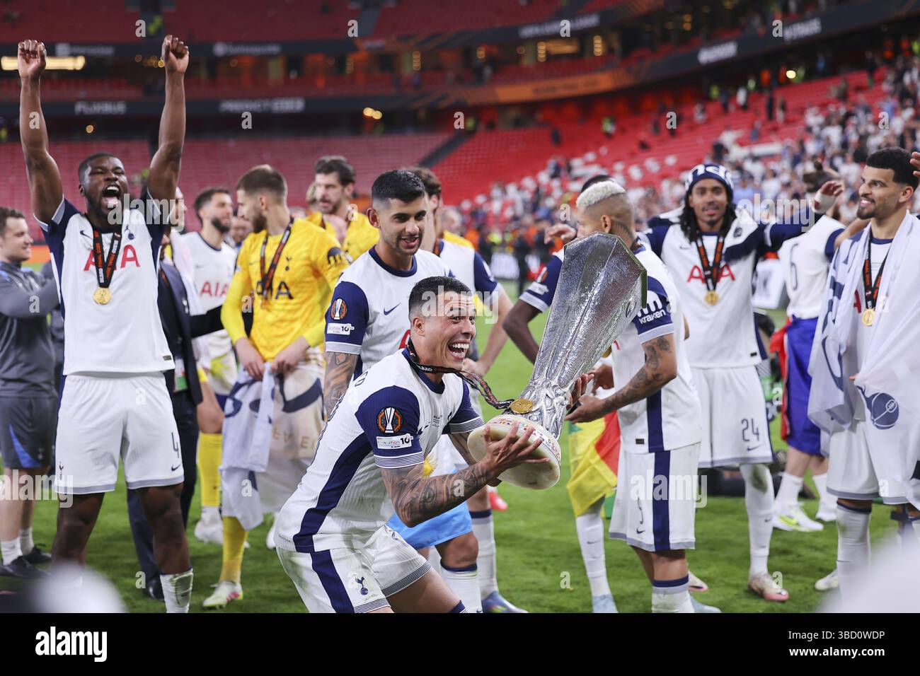 Pedro Porro of Tottenham celebrates with the trophy after winning the ...