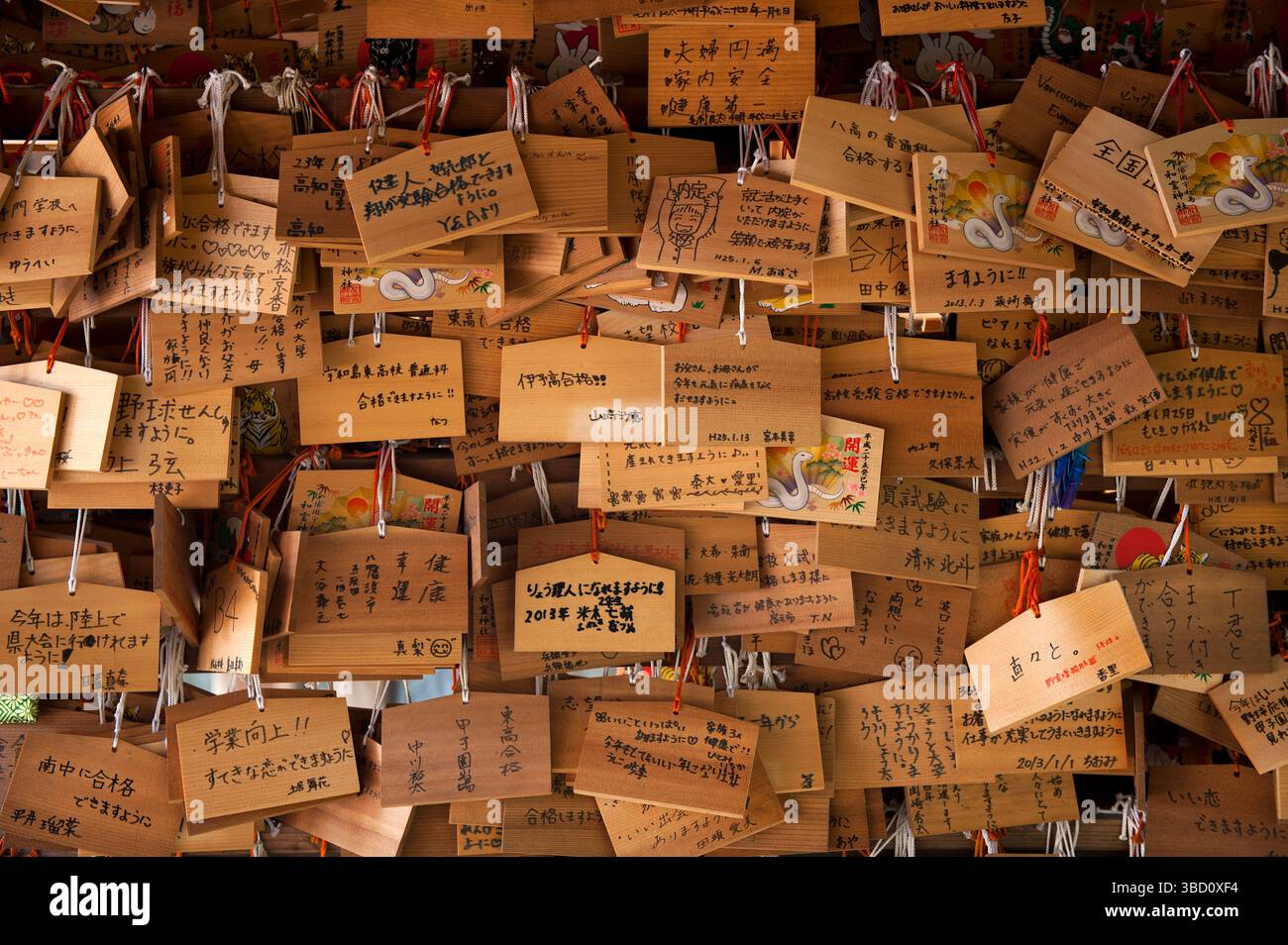 Wooden prayer or wish tablets called "ema" are commonplace at Shinto ...