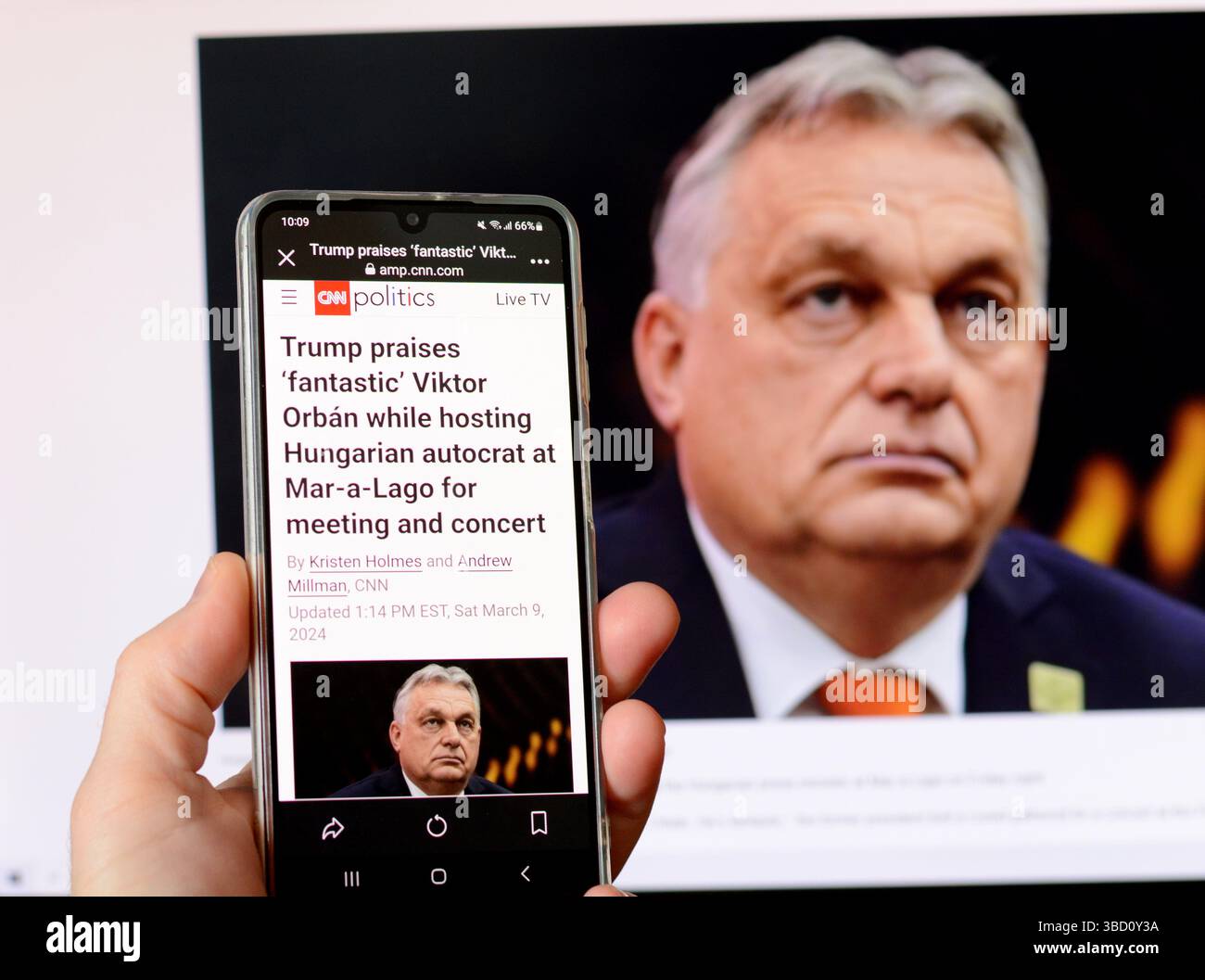 Smartphone and PC screen showing CNN news article with images of Donald ...