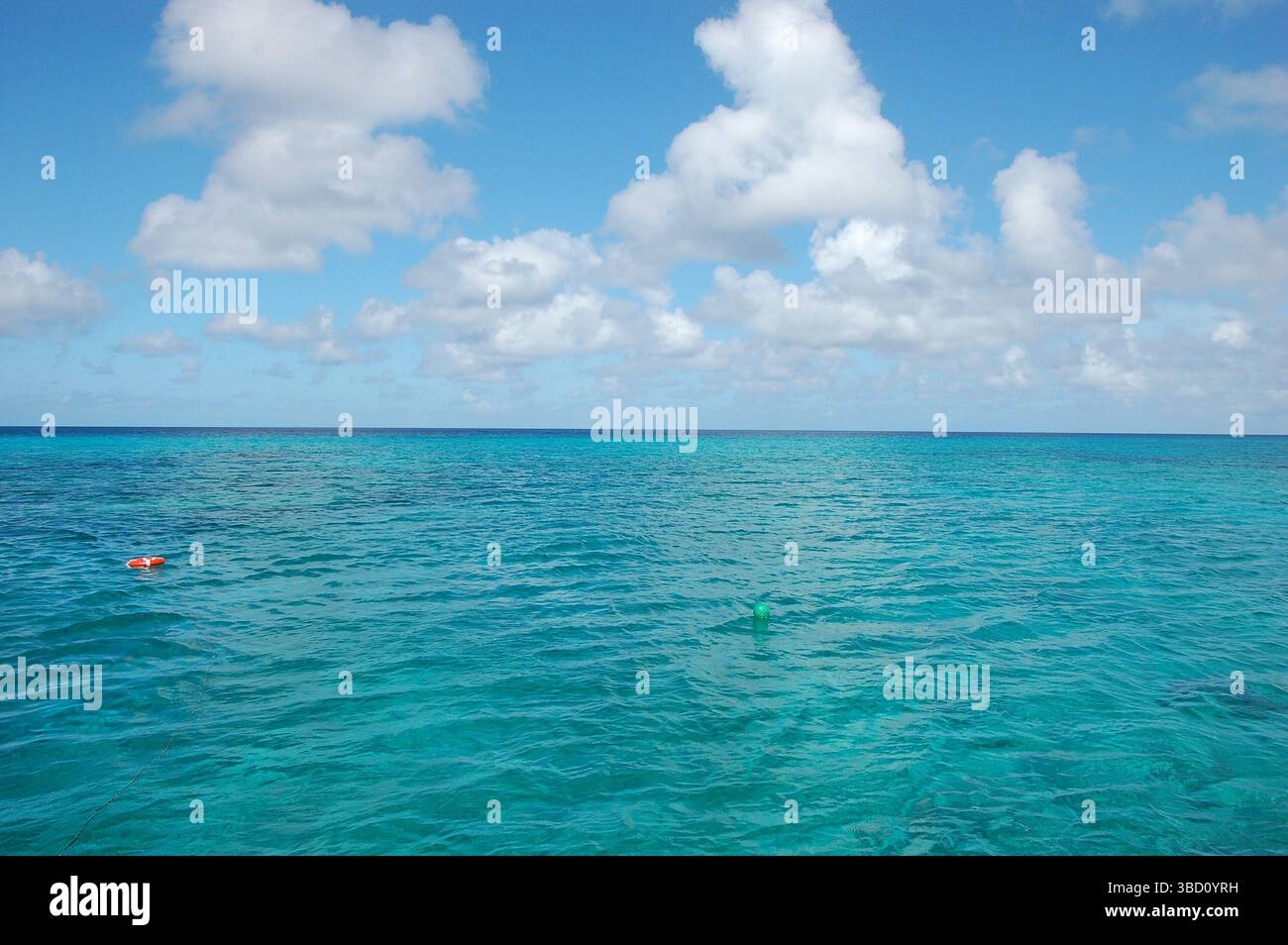 Red life saver floating in the turquoise sea near Grand Turk ...
