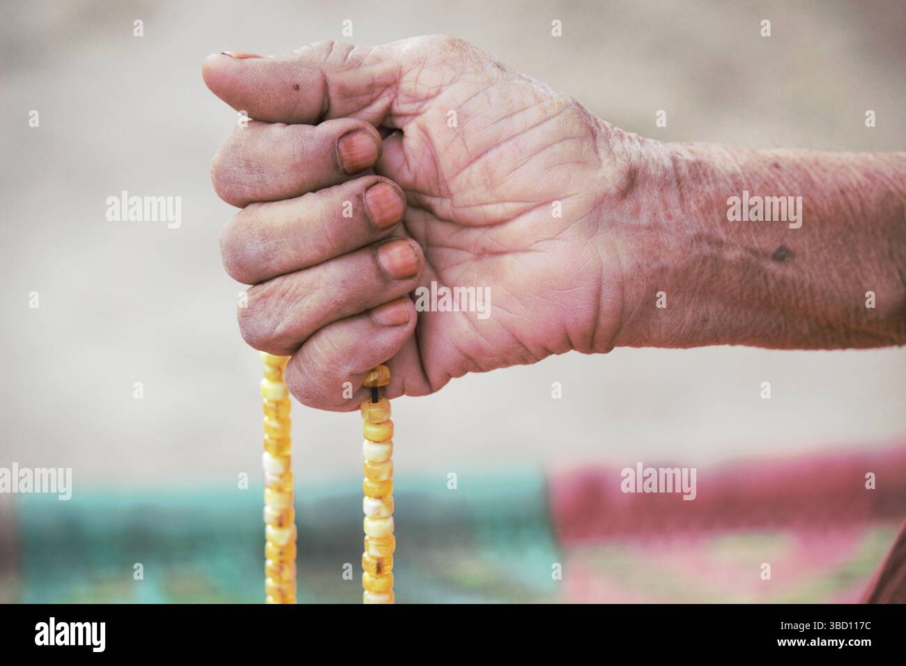Close-Up of Elderly Hand Holding Prayer Beads, Symbol of Faith ...