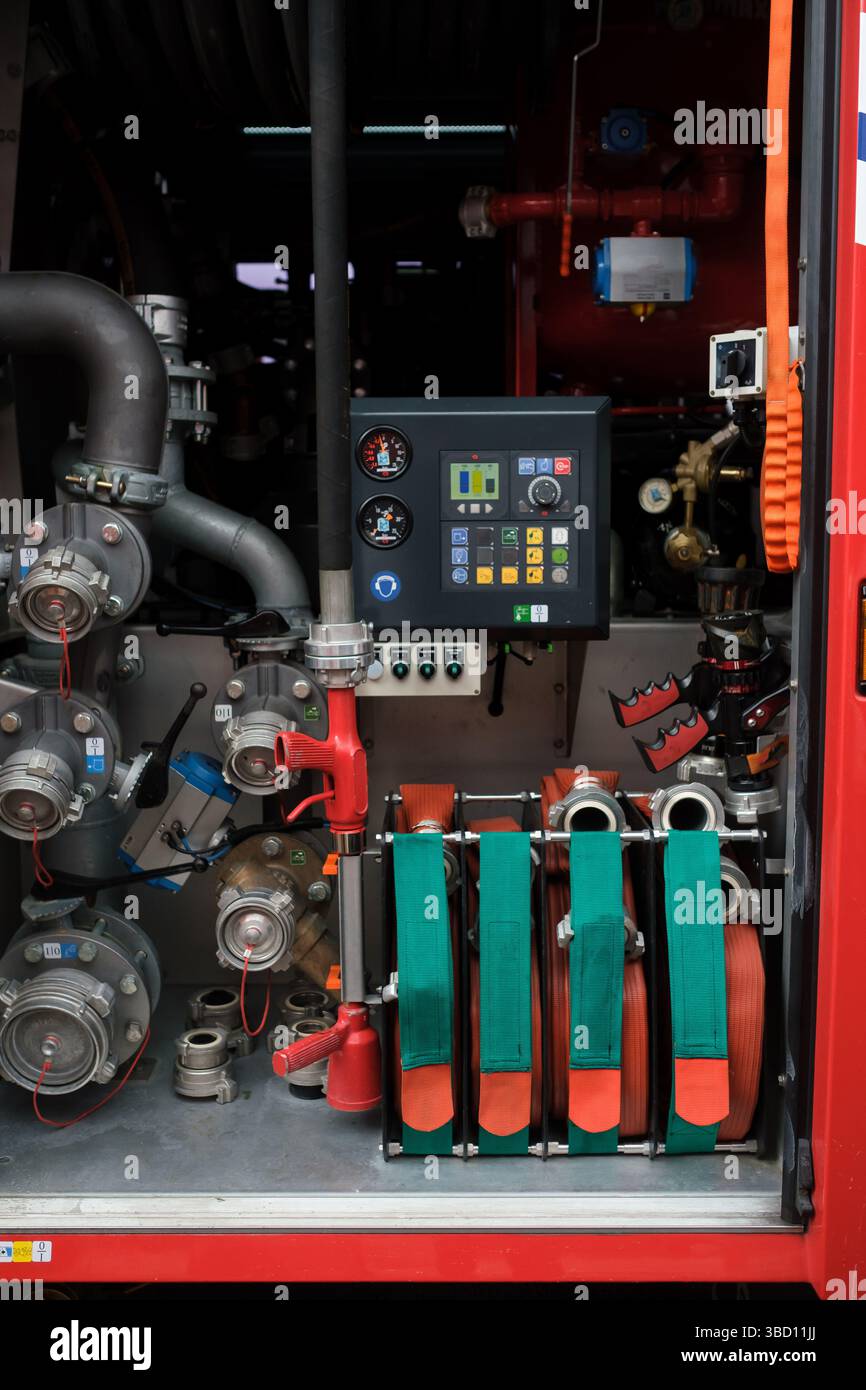 Equipment used for firefighting is neatly organized in a fire truck ...