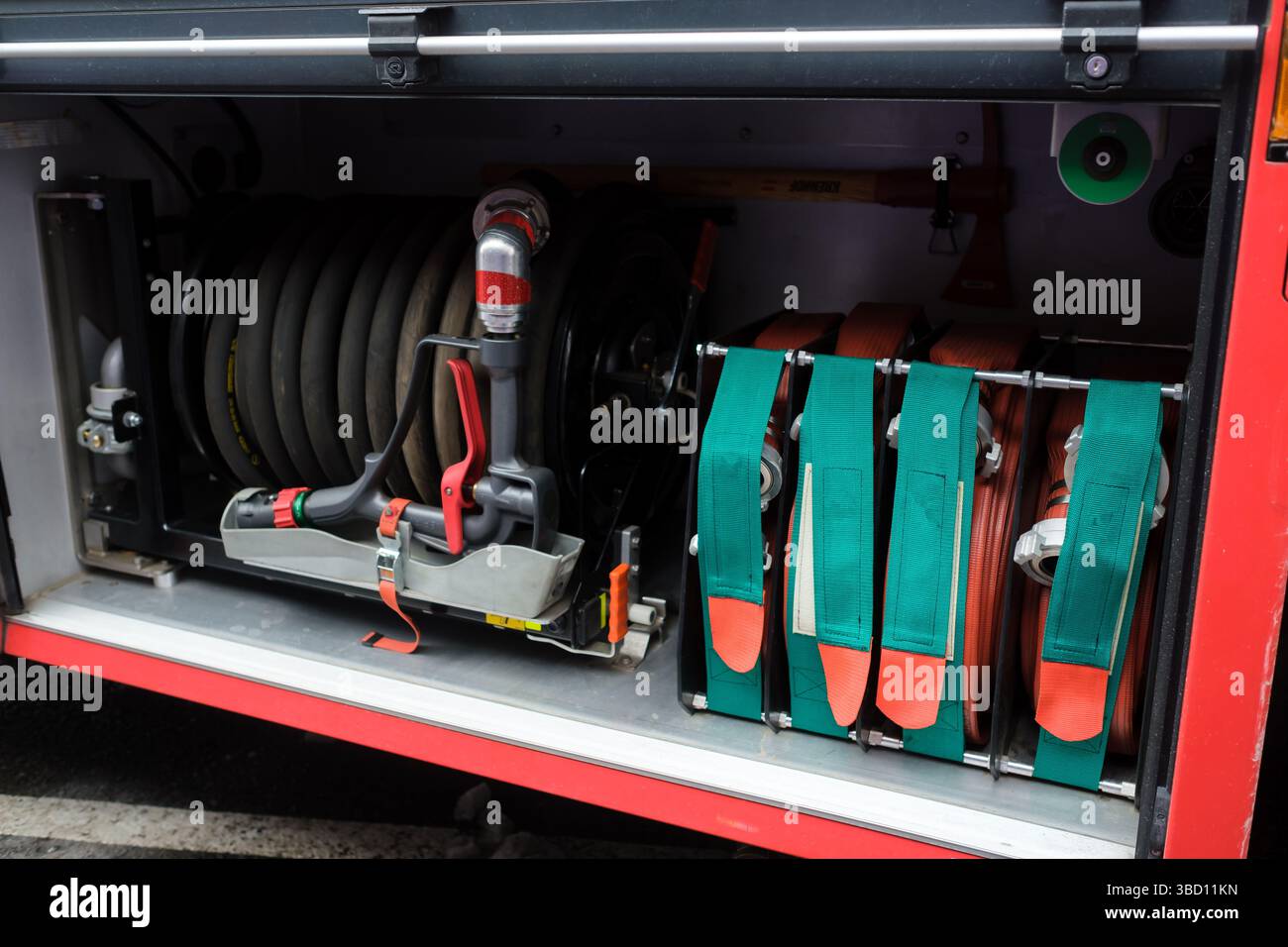 Equipment used for firefighting is neatly organized in a fire truck ...