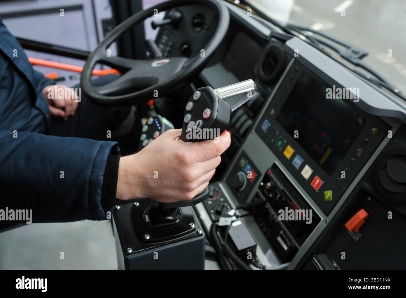 Worker maneuvering joystick in hi-res stock photography and images - Alamy