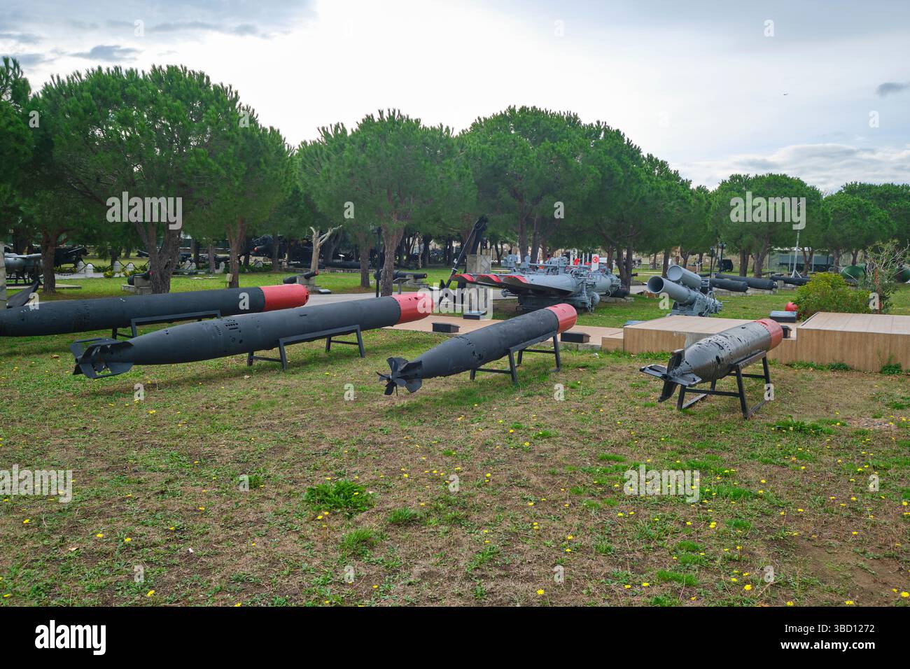 A display of black metal torpedos, used during WWI, The Great War. At ...