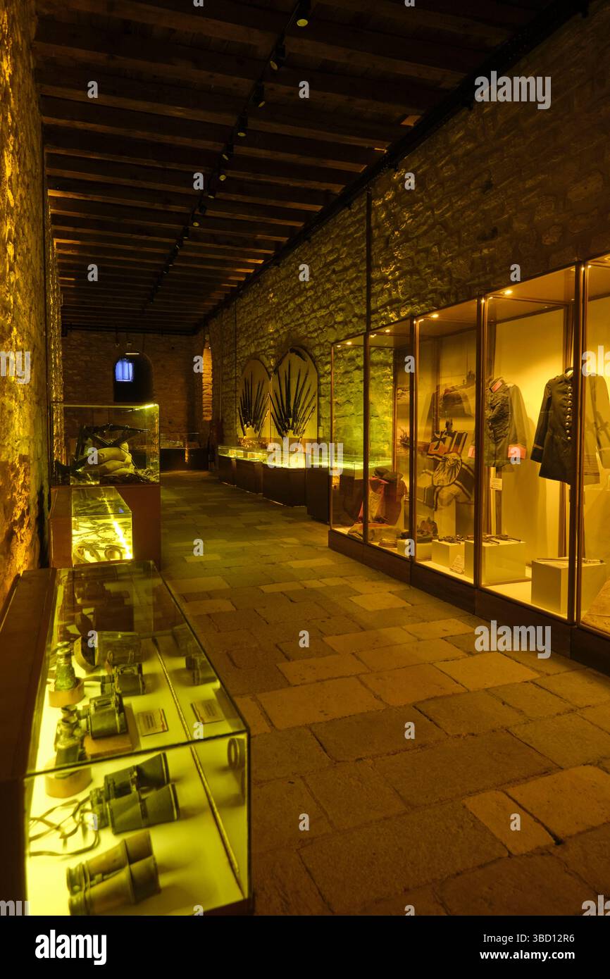 Various weapons, guns, uniforms and other objects on display. At the ...