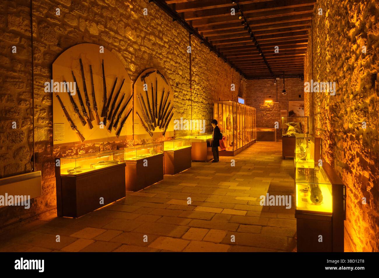 A large display of rifles, guns, weapons on display, items used during ...